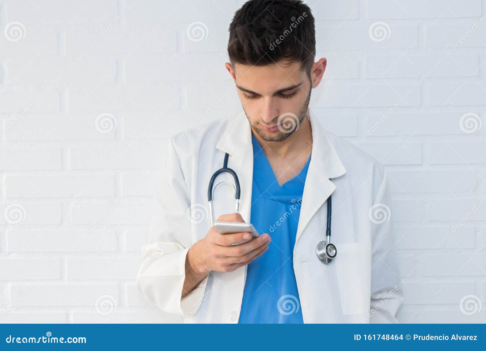 Doctor with cellphone stock photo. Image of medicine - 161748464