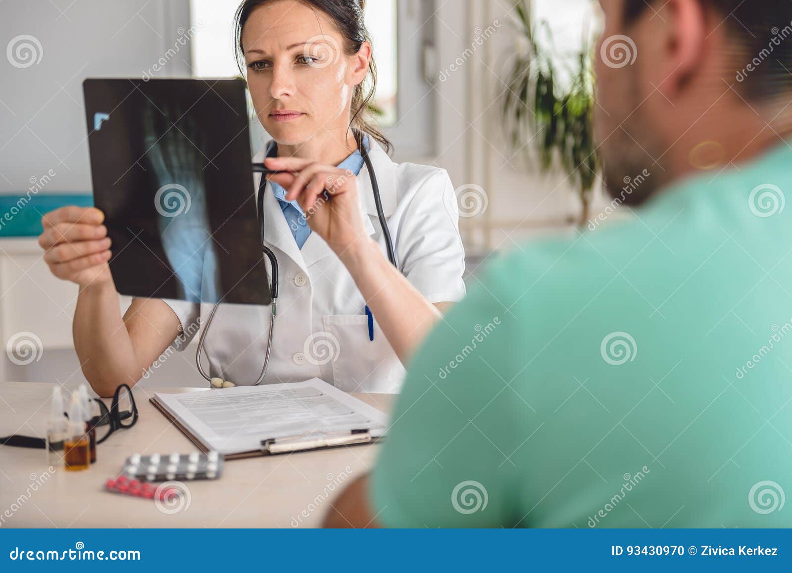 Doctor Checking the Ankle X-ray Stock Photo - Image of ethnicity ...