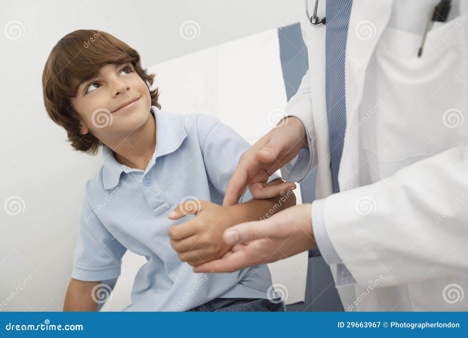 Doctor Checking Boy S Pulse Stock Image - Image of medical ...