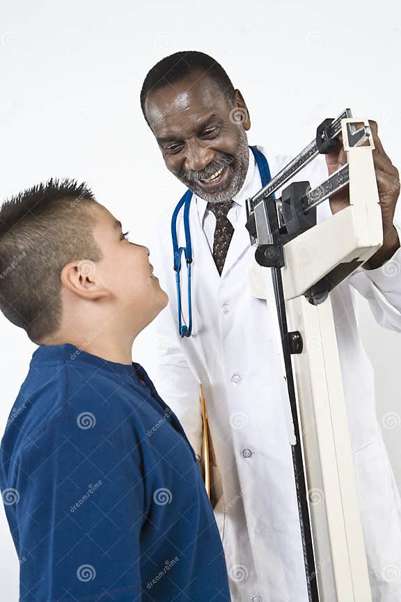 Doctor Checking Boy S Weight Stock Photo - Image of hispanic, boomer ...