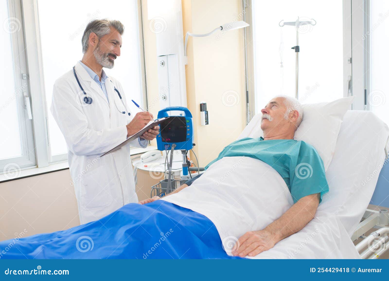 Doctor Checking on Confined Patient Stock Photo - Image of healthcare ...