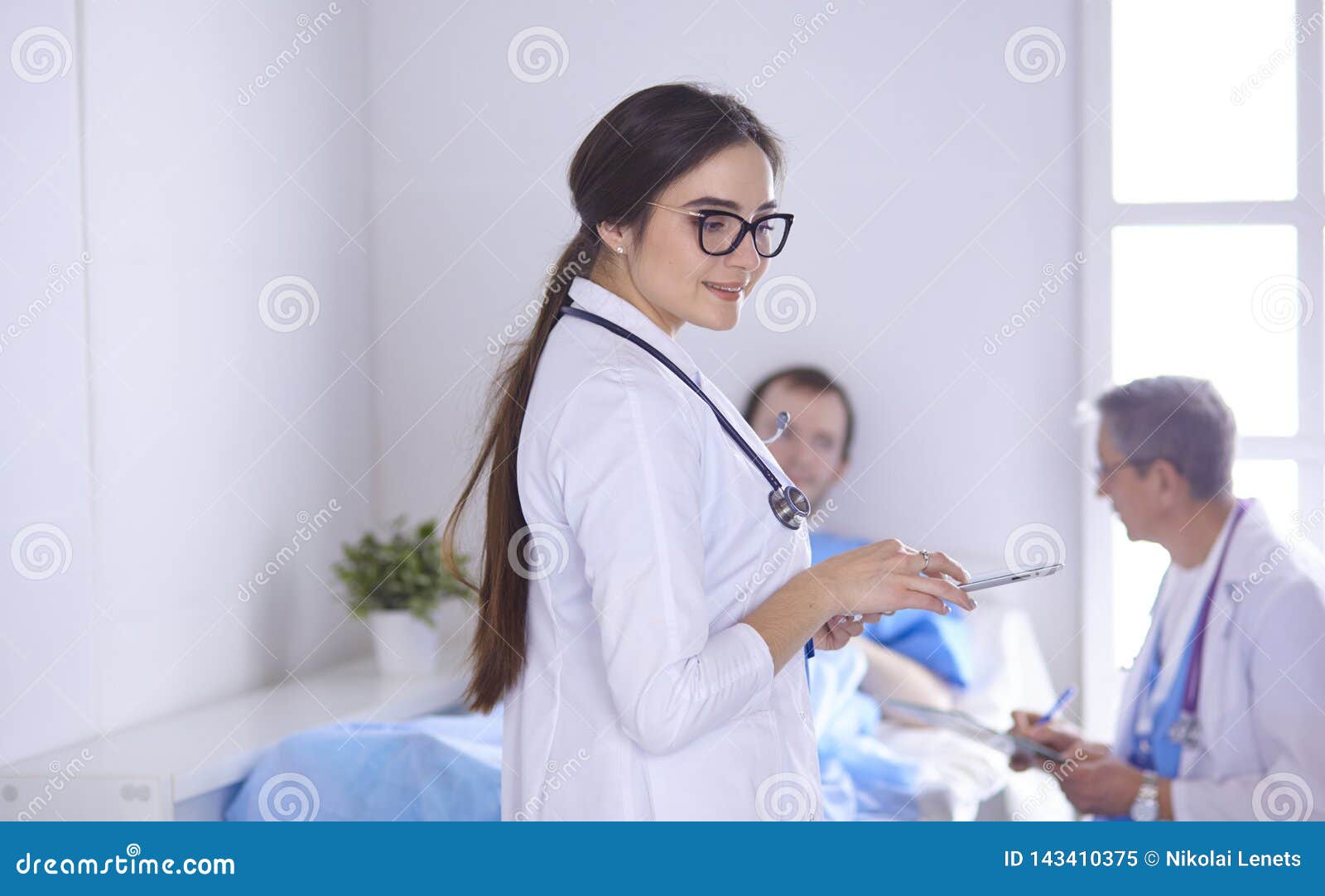 Doctor Checking Heart Beat of Patient in Bed with Stethoscope Stock ...