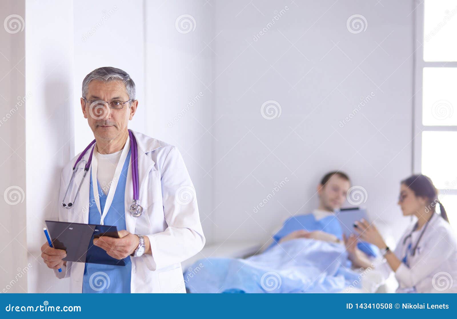 Doctor Checking Heart Beat of Patient in Bed with Stethoscope Stock ...