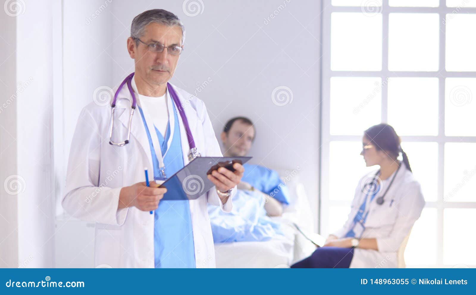 Doctor Checking Heart Beat of Patient in Bed with Stethoscope Stock ...