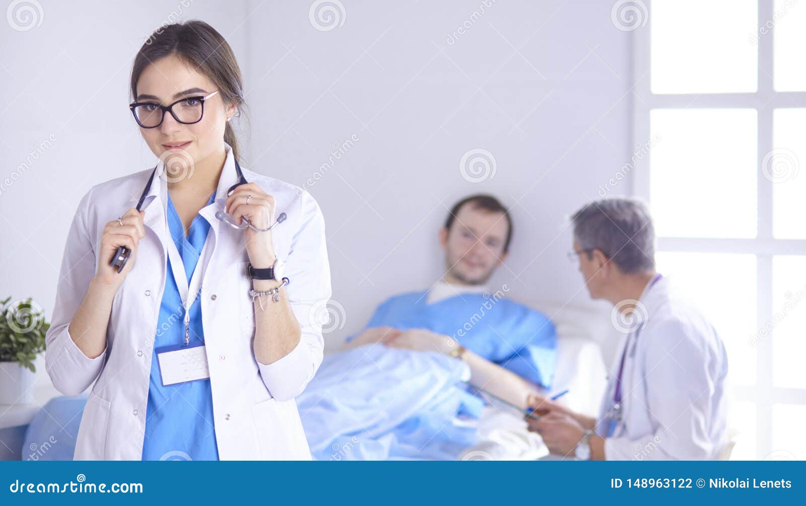 Doctor Checking Heart Beat of Patient in Bed with Stethoscope Stock ...