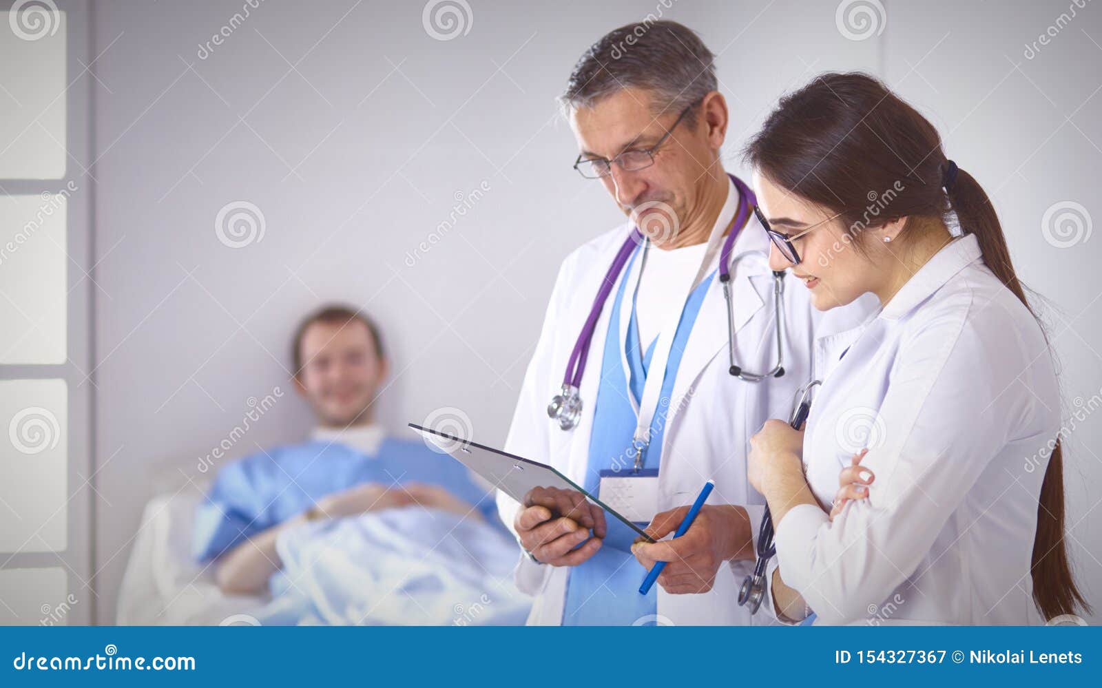 Doctor Checking Heart Beat of Patient in Bed with Stethoscope Stock ...