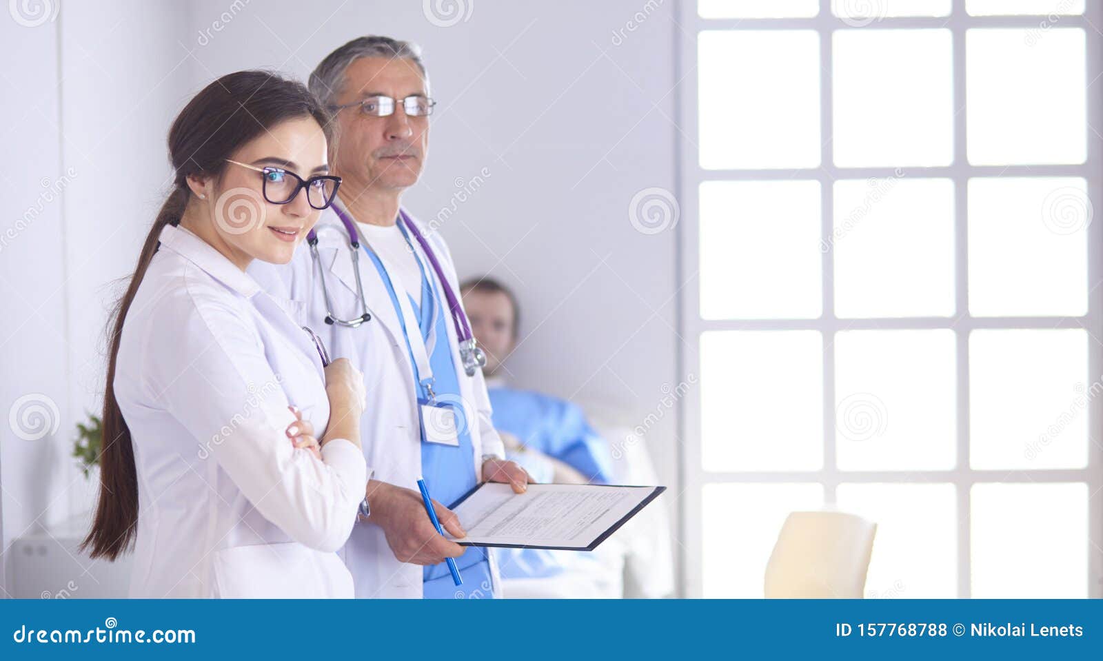Doctor Checking Heart Beat of Patient in Bed with Stethoscope Stock ...