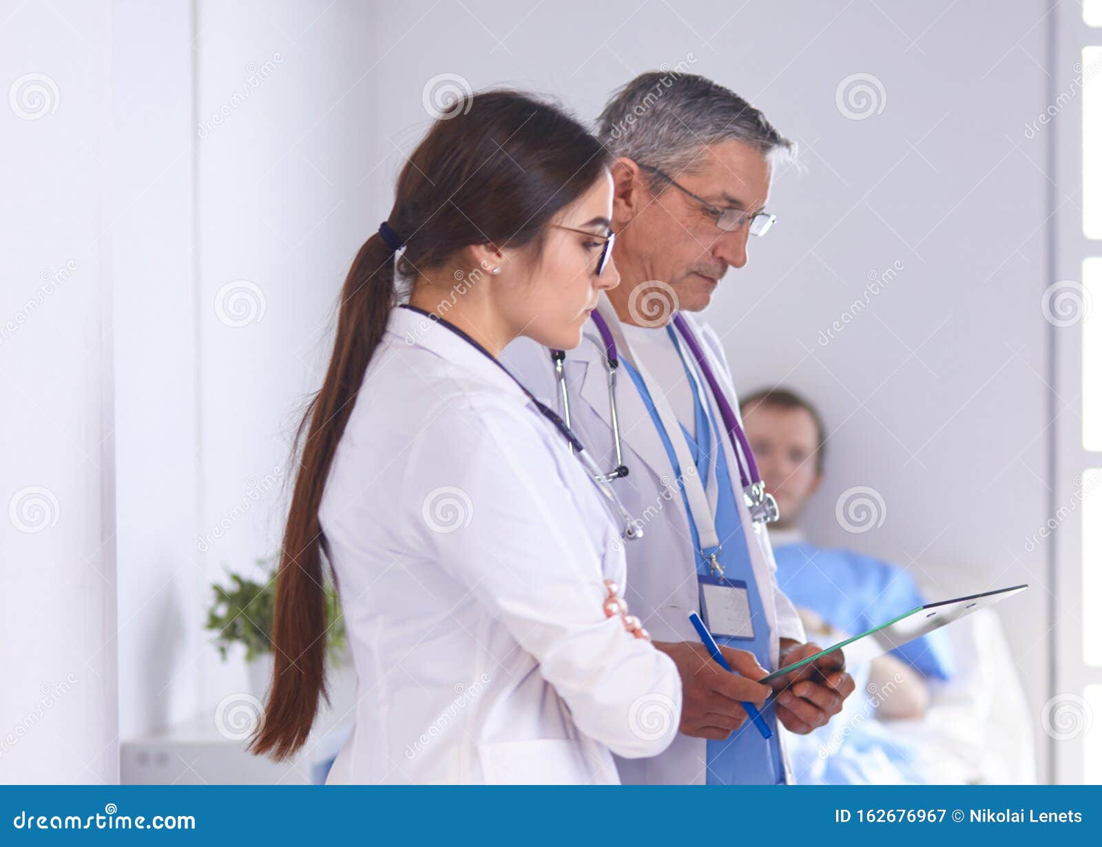 Doctor Checking Heart Beat of Patient in Bed with Stethoscope Stock ...