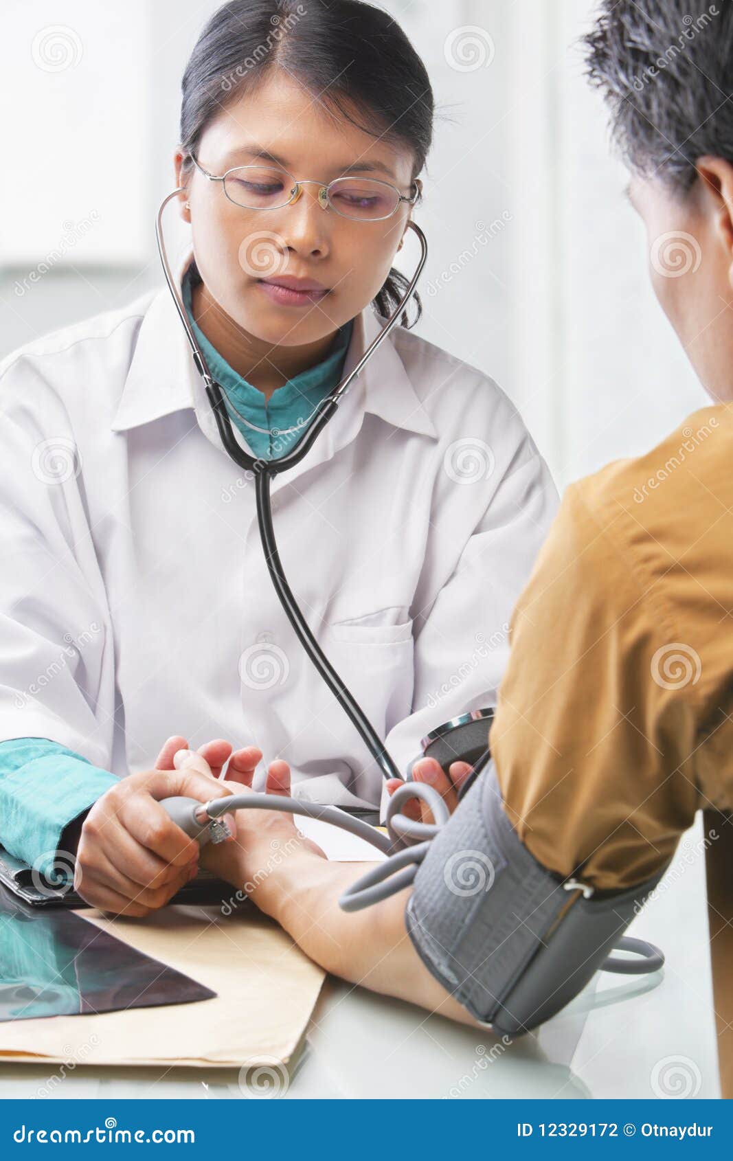 Doctor Checking Patient Blood Pressure Stock Photo - Image of medical ...