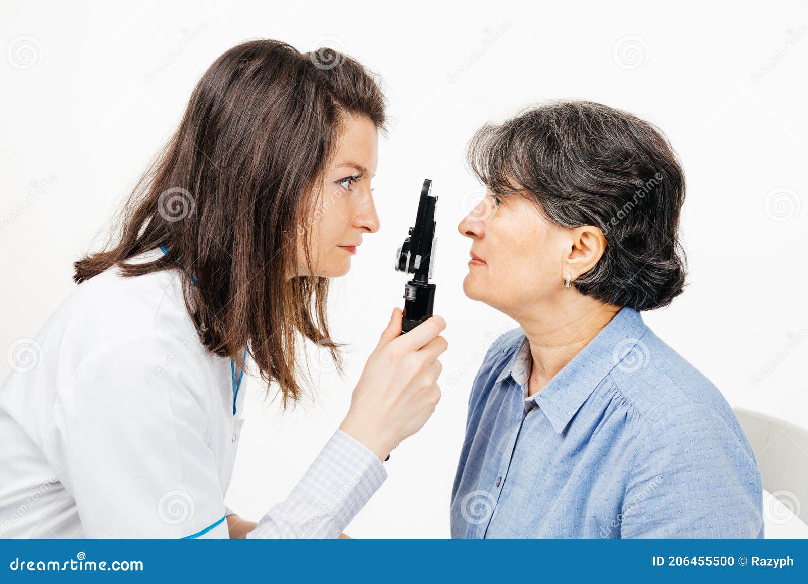 Doctor Checking a Patient Eyes Stock Photo - Image of optician, female ...