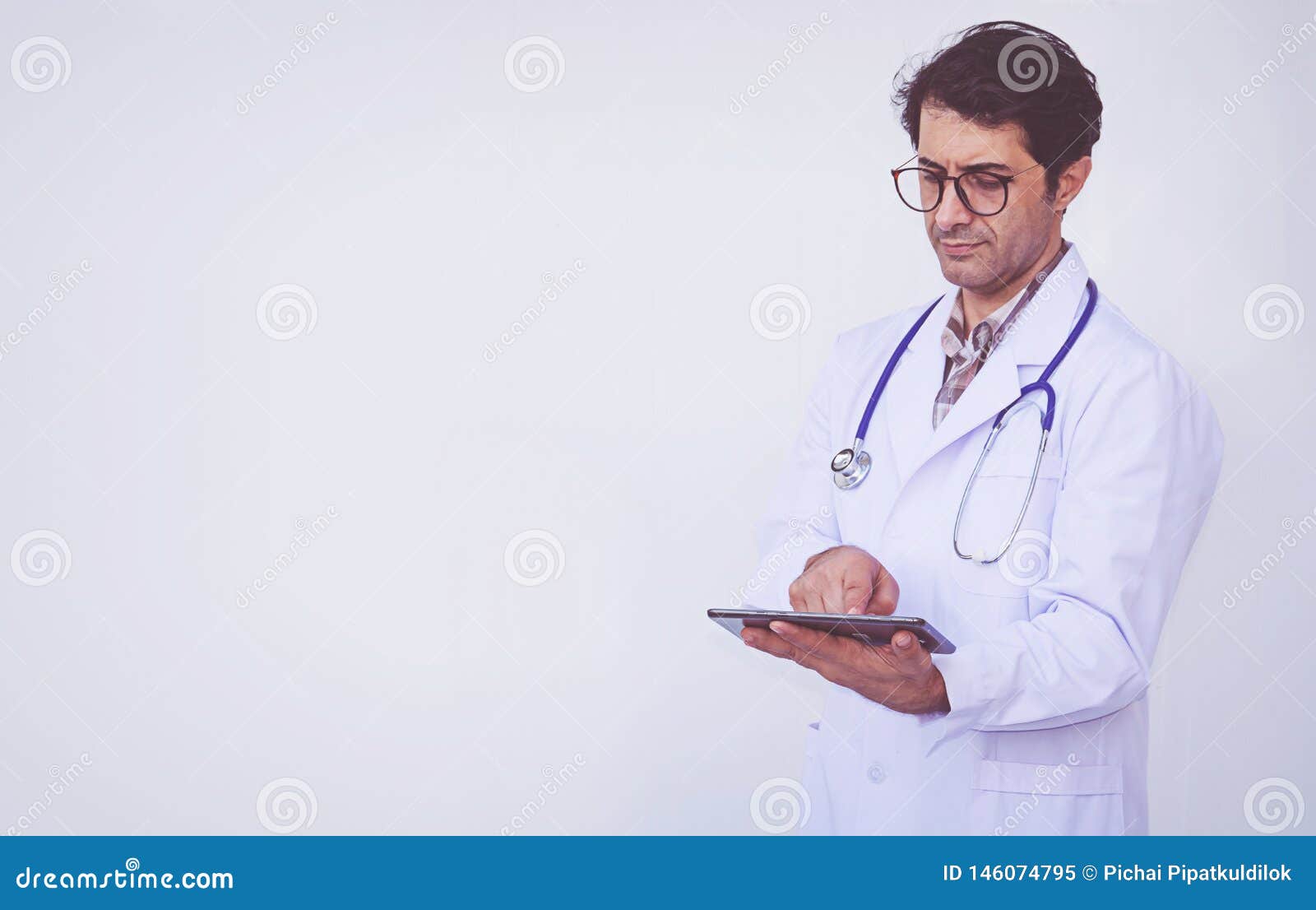 Doctor Checking Patient Information on a Tablet Device Stock Image ...