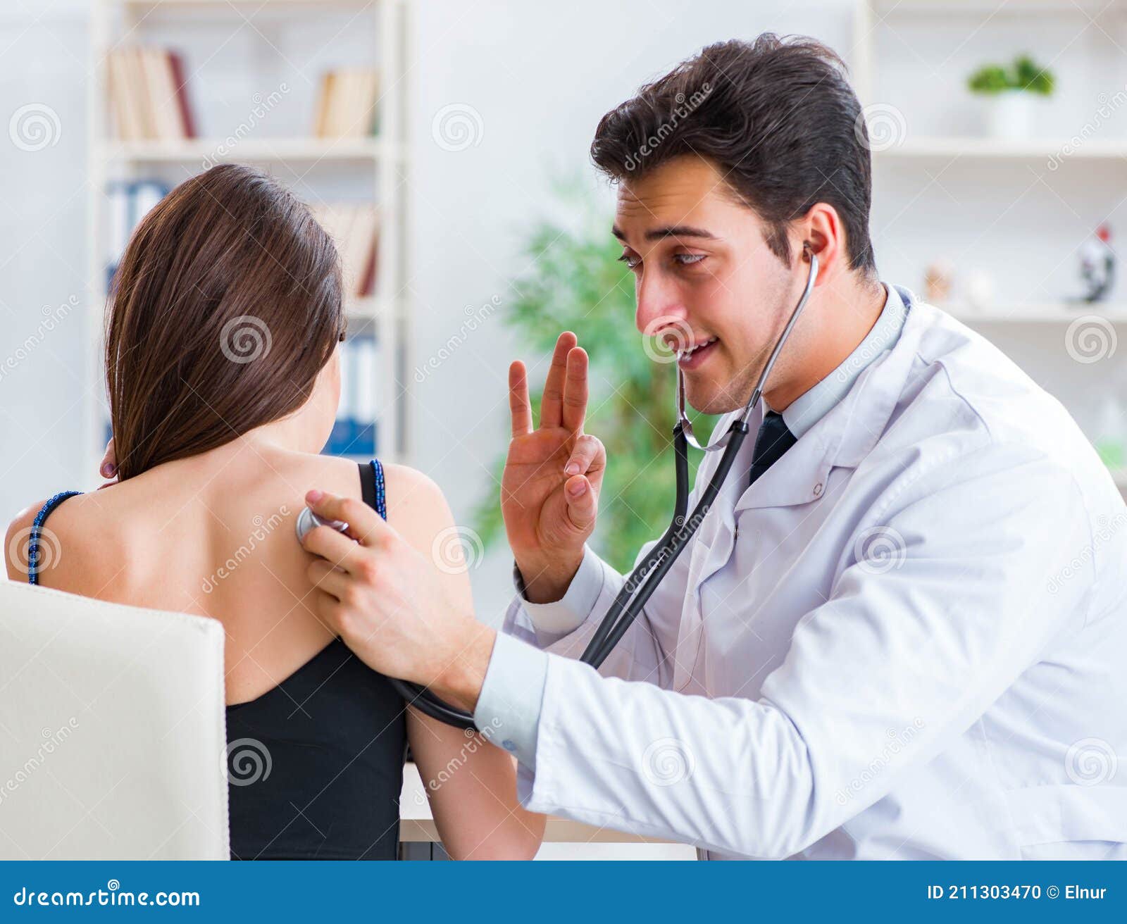 Doctor Checking Patient with Stethoscope Stock Photo - Image of ...
