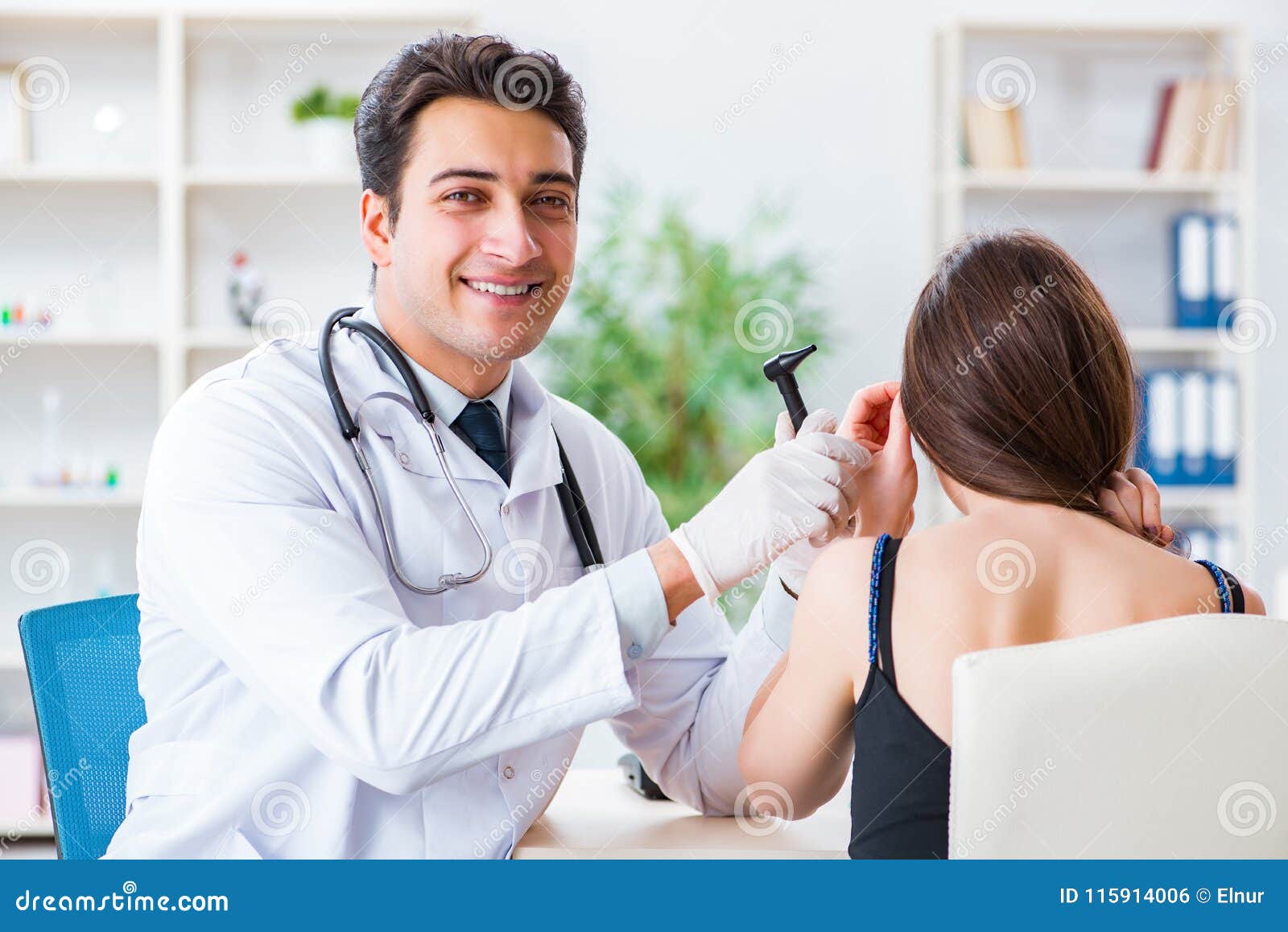 The Doctor Checking Patients Ear during Medical Examination Stock Photo ...
