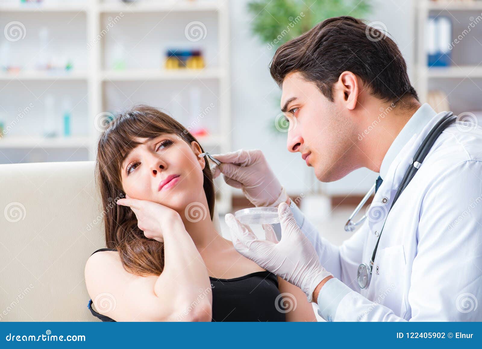 The Doctor Checking Patients Ear during Medical Examination Stock Photo ...