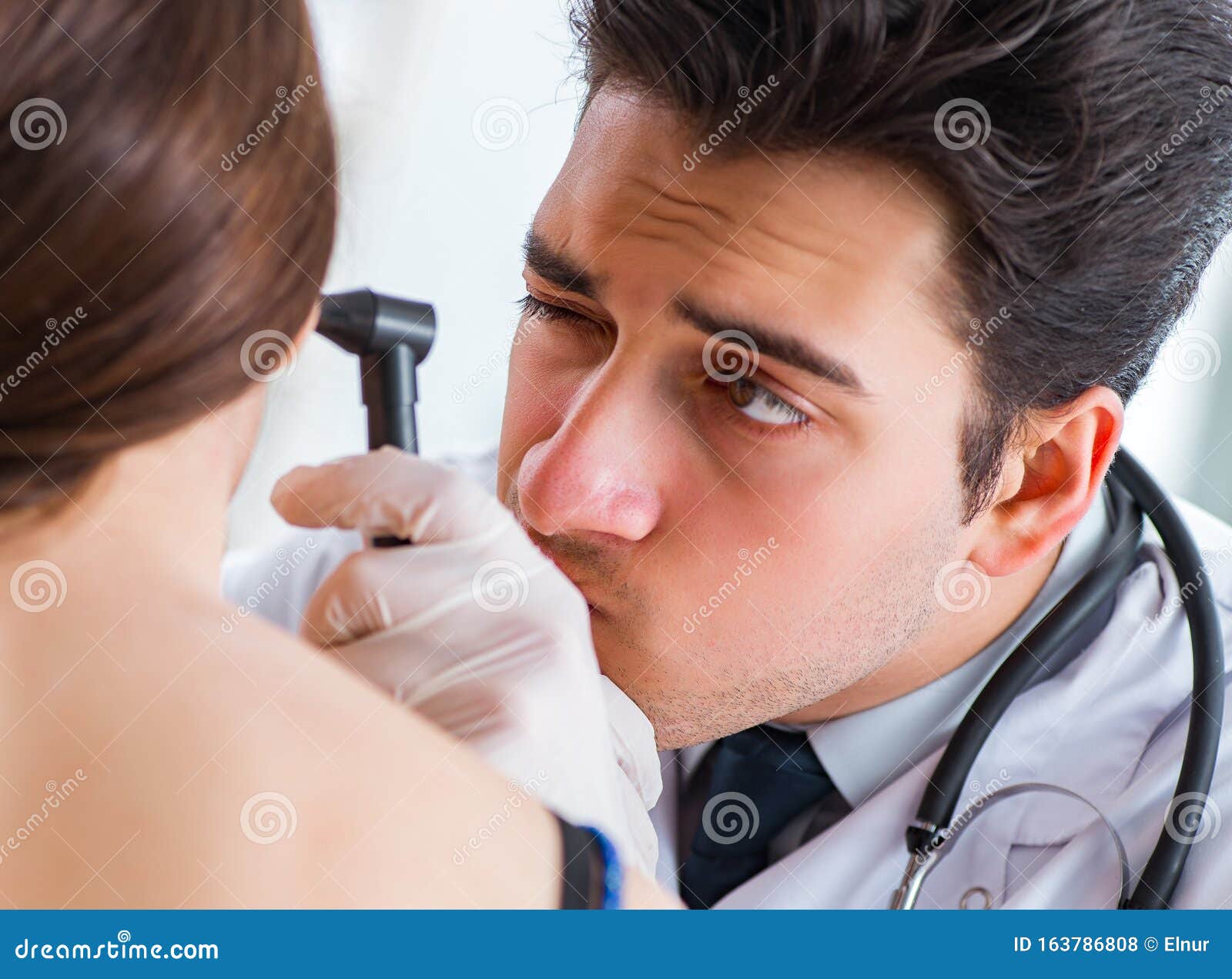 Doctor Checking Patients Ear during Medical Examination Stock Photo ...
