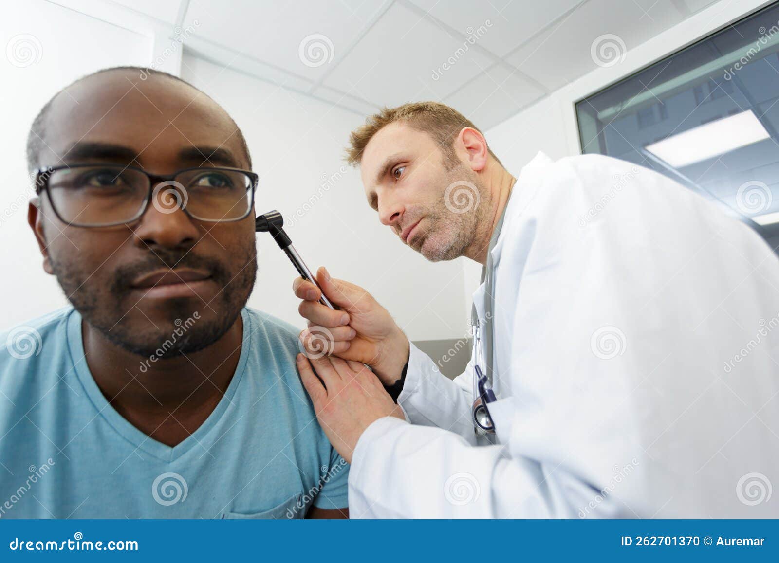 Doctor Checking Patients Ear during Medical Examination Stock Photo ...