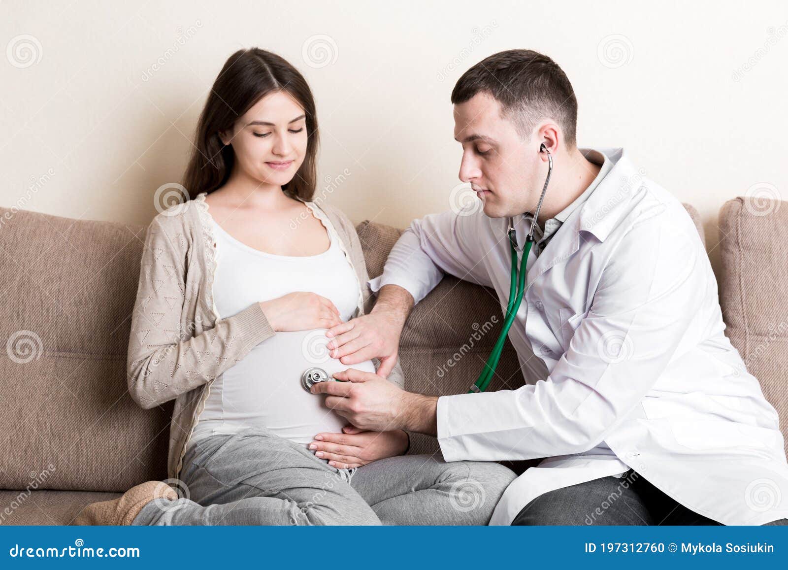 Doctor Is Checking Pregnant Woman`s Belly With A Stethoscope Physician