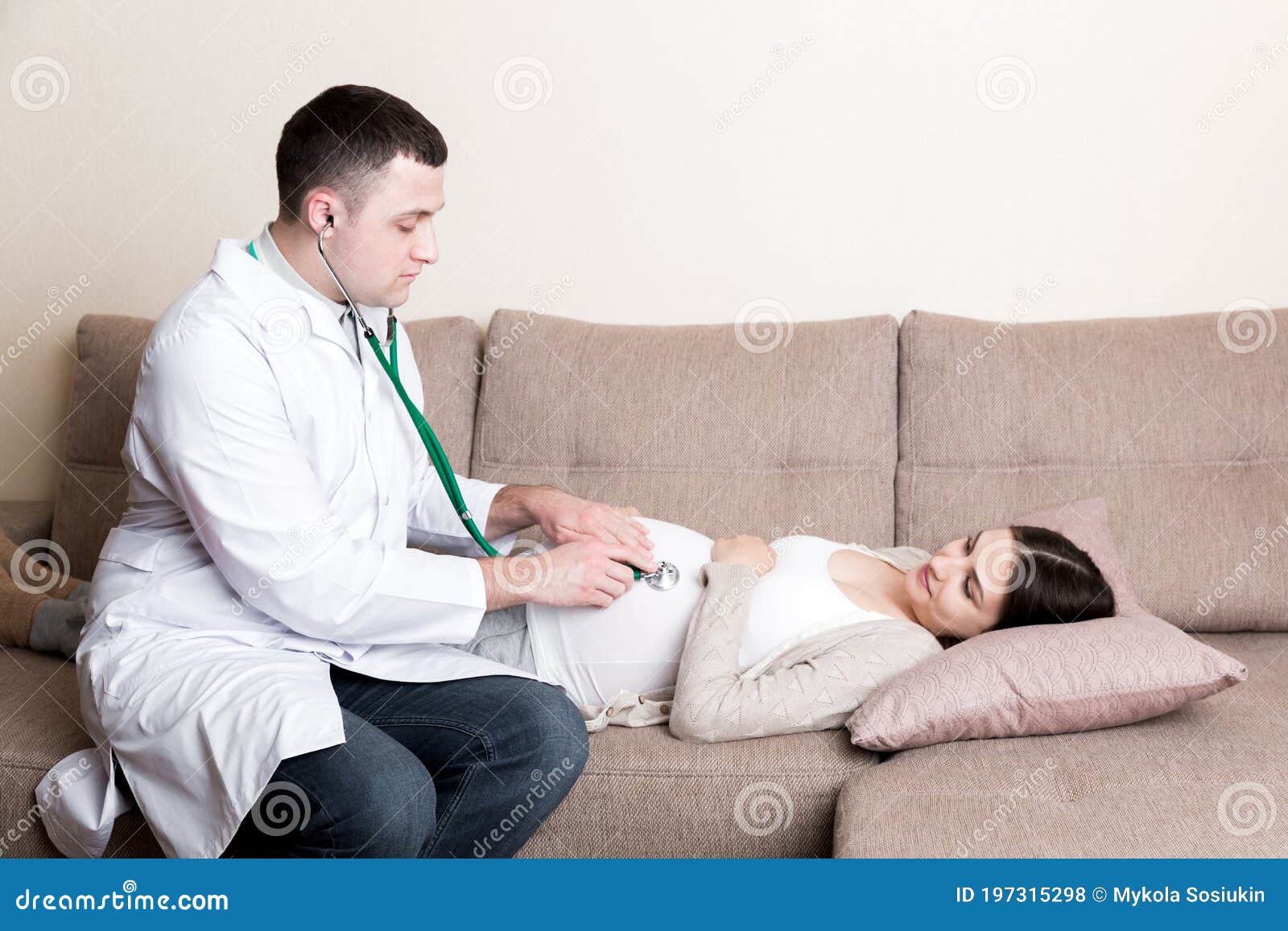 Doctor Is Checking Pregnant Woman`s Belly With A Stethoscope Physician