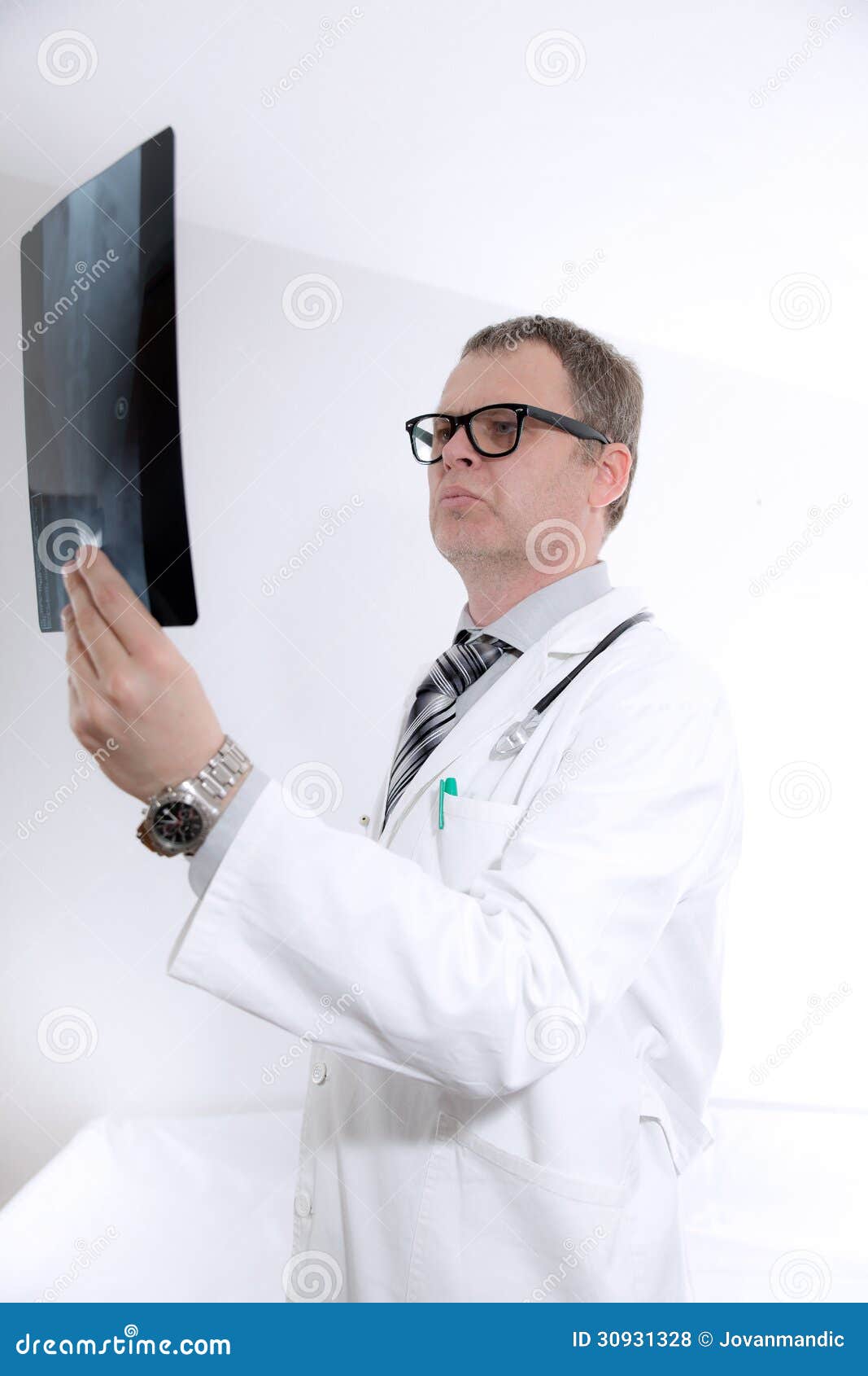 Doctor Checking X-ray Image Stock Photo - Image of expertise, magnetic ...