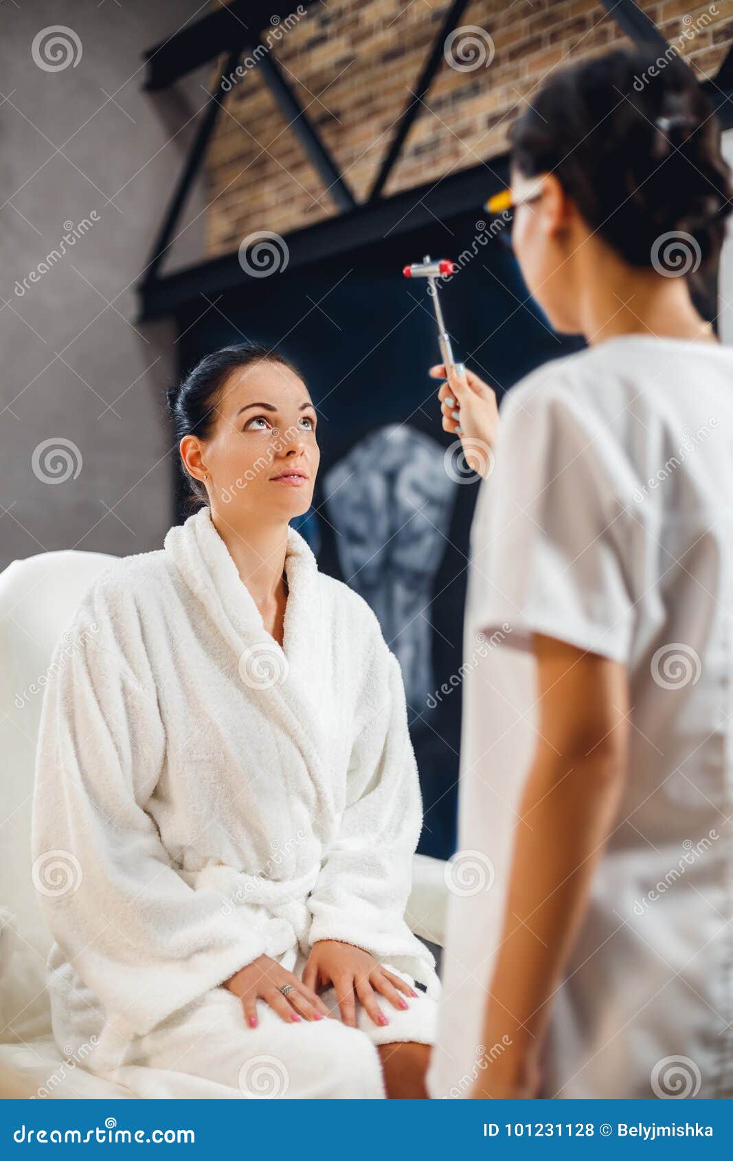 Doctor Checking Reflexes of His Patient with Reflex Hammer. Stock Photo ...