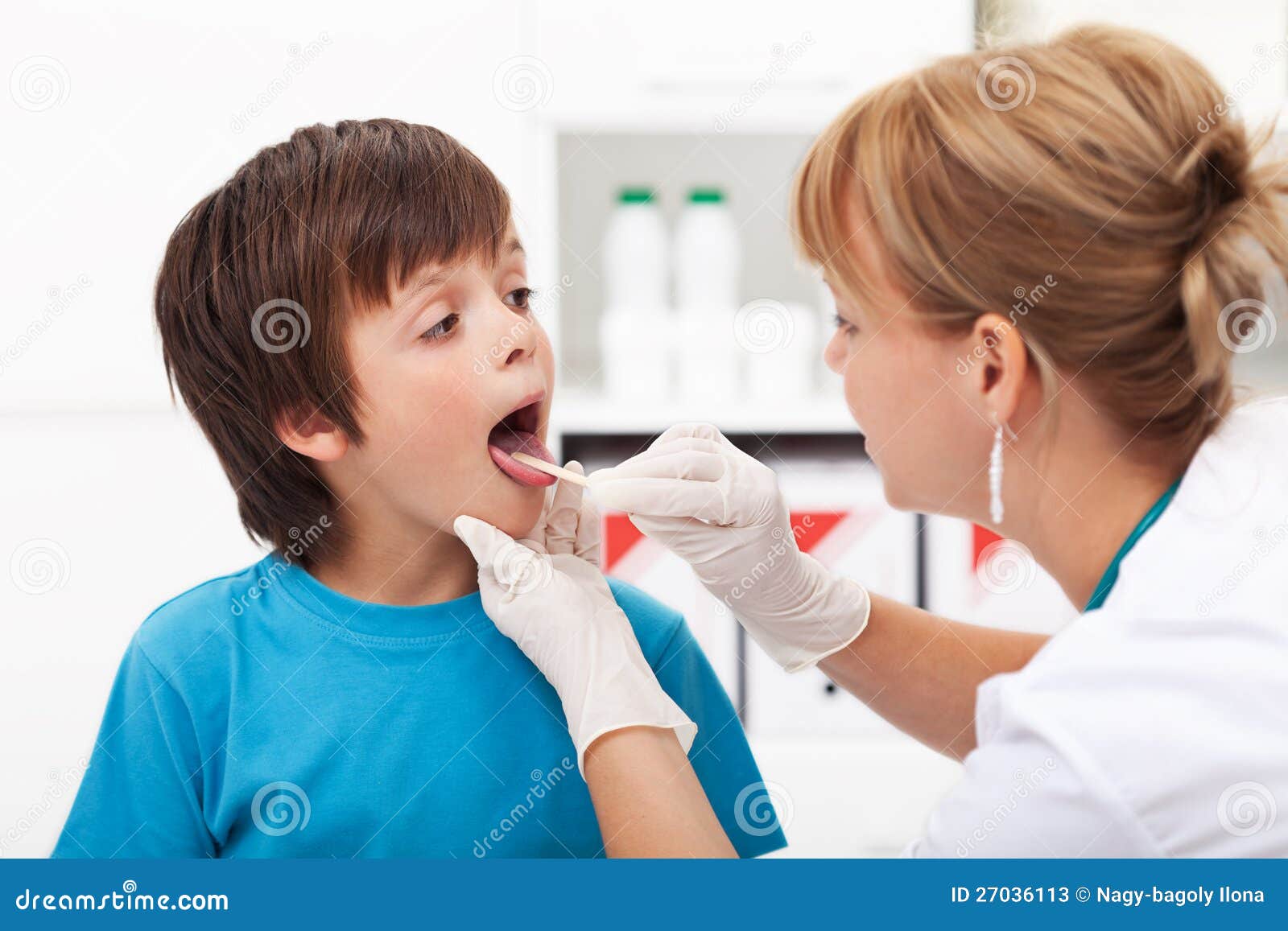 Doctor Checking the Throat of a Young Boy Stock Image - Image of ...