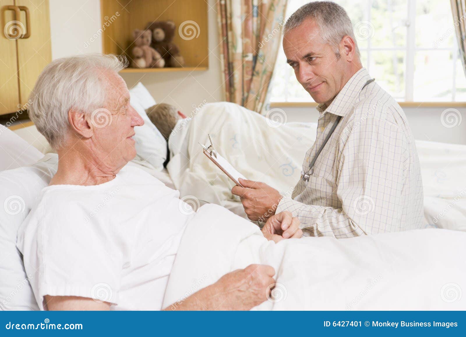 Doctor Checking Up on Senior Man in Hospital Stock Image - Image of ...