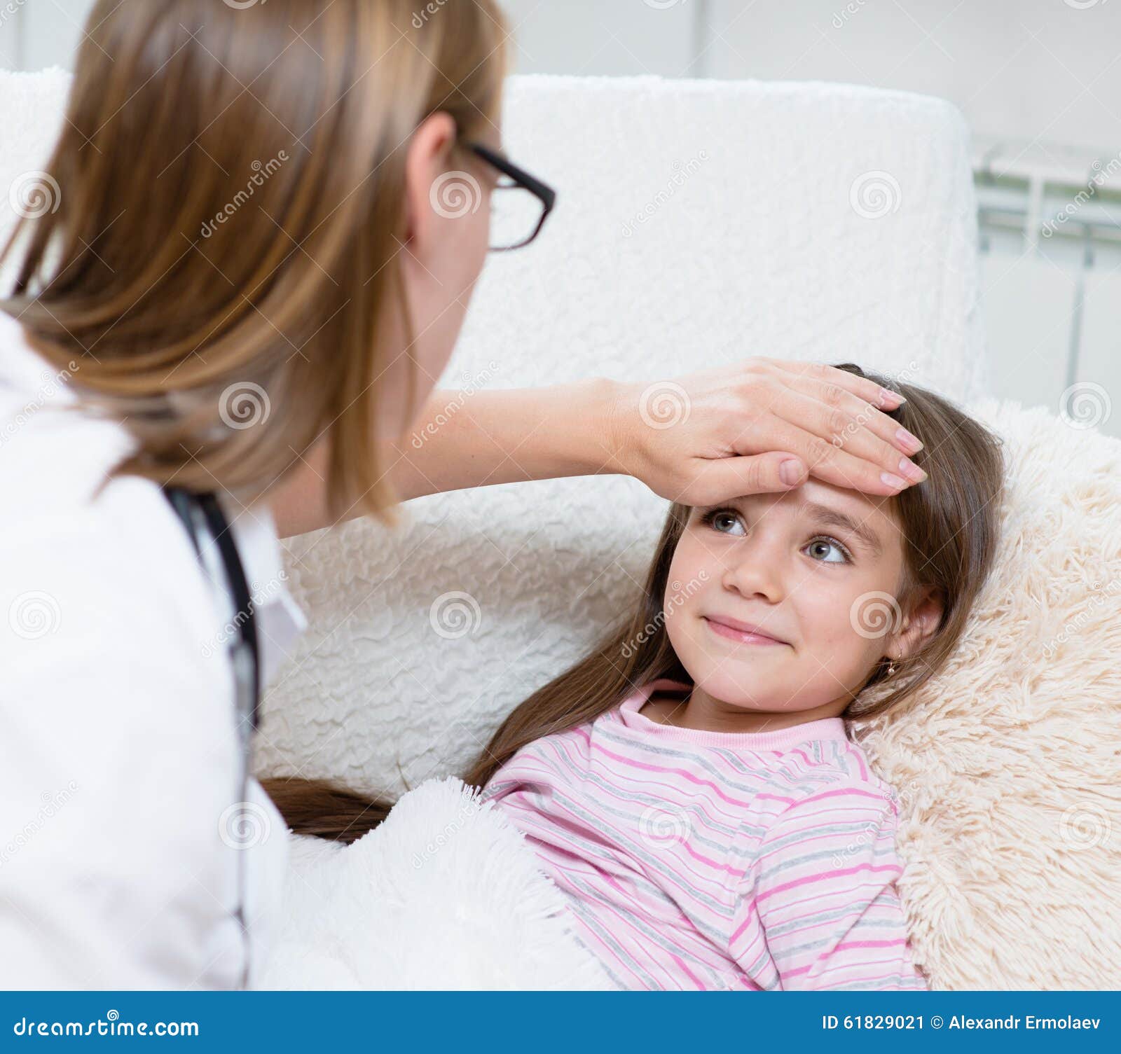 Doctor Checks The Temperature Of Baby Touching His Forehead Royalty ...