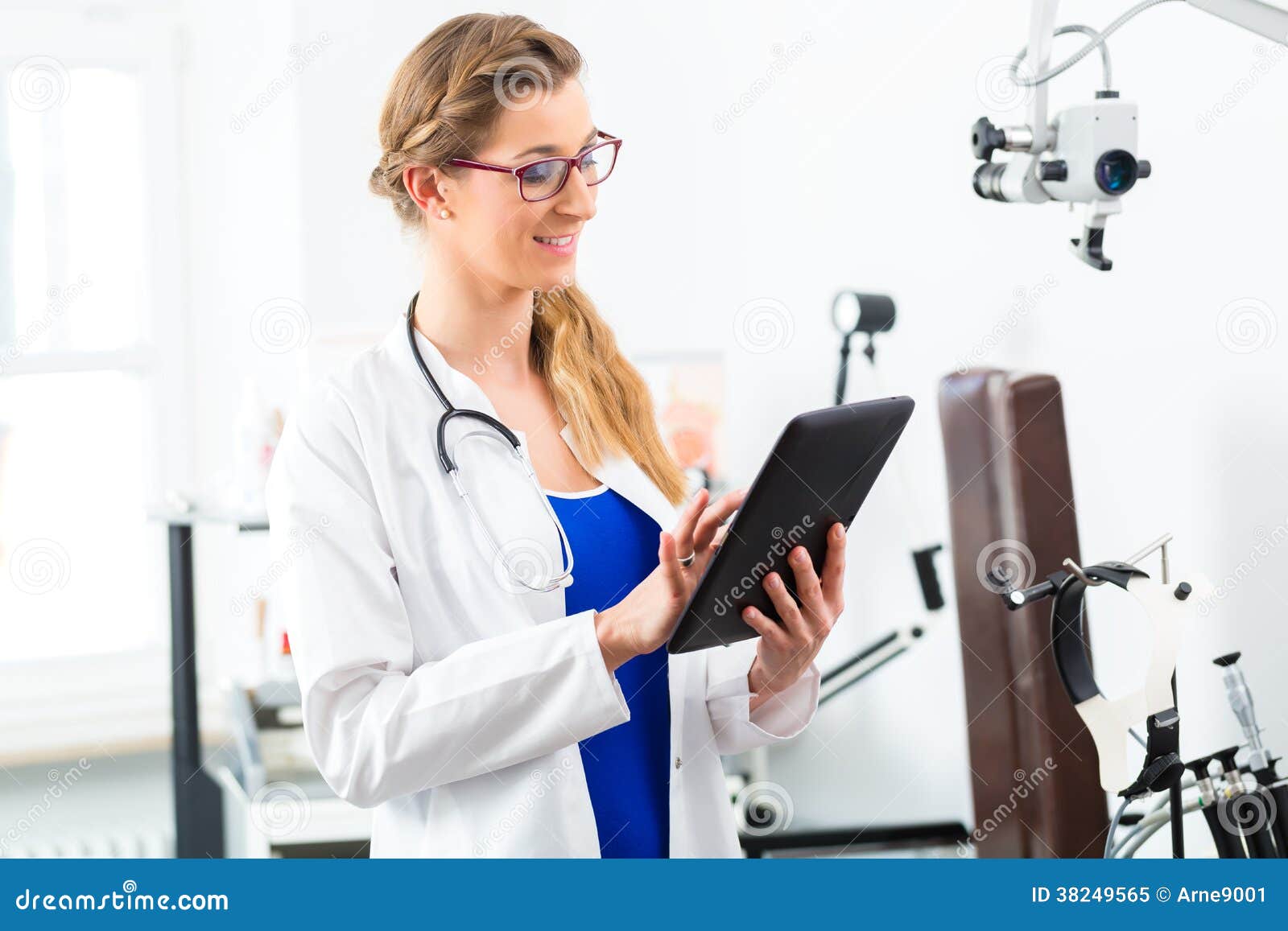Doctor in Clinic Reading Digital File on Tablet Computer Stock Image ...