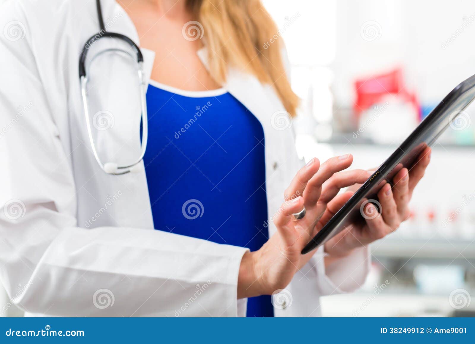 Doctor in Clinic Reading Digital File on Tablet Computer Stock Photo ...