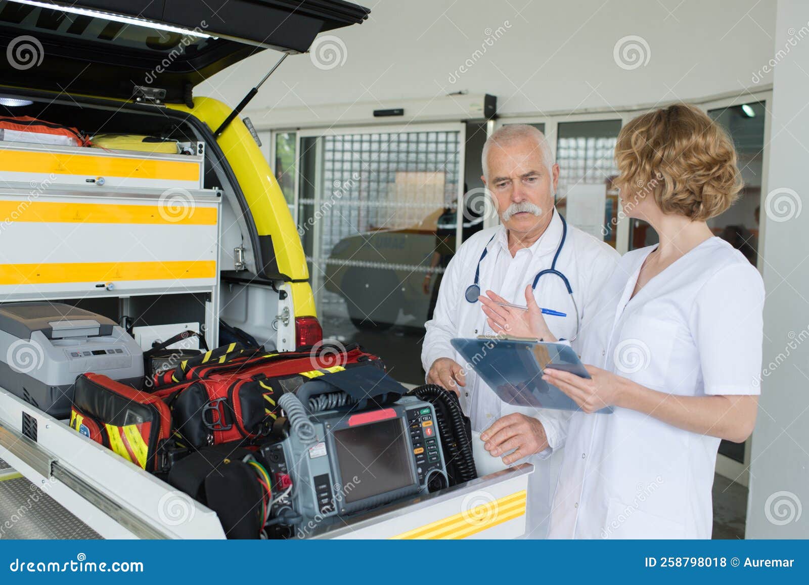 Doctor with Clipping Board Talking To Manager Stock Photo - Image of ...