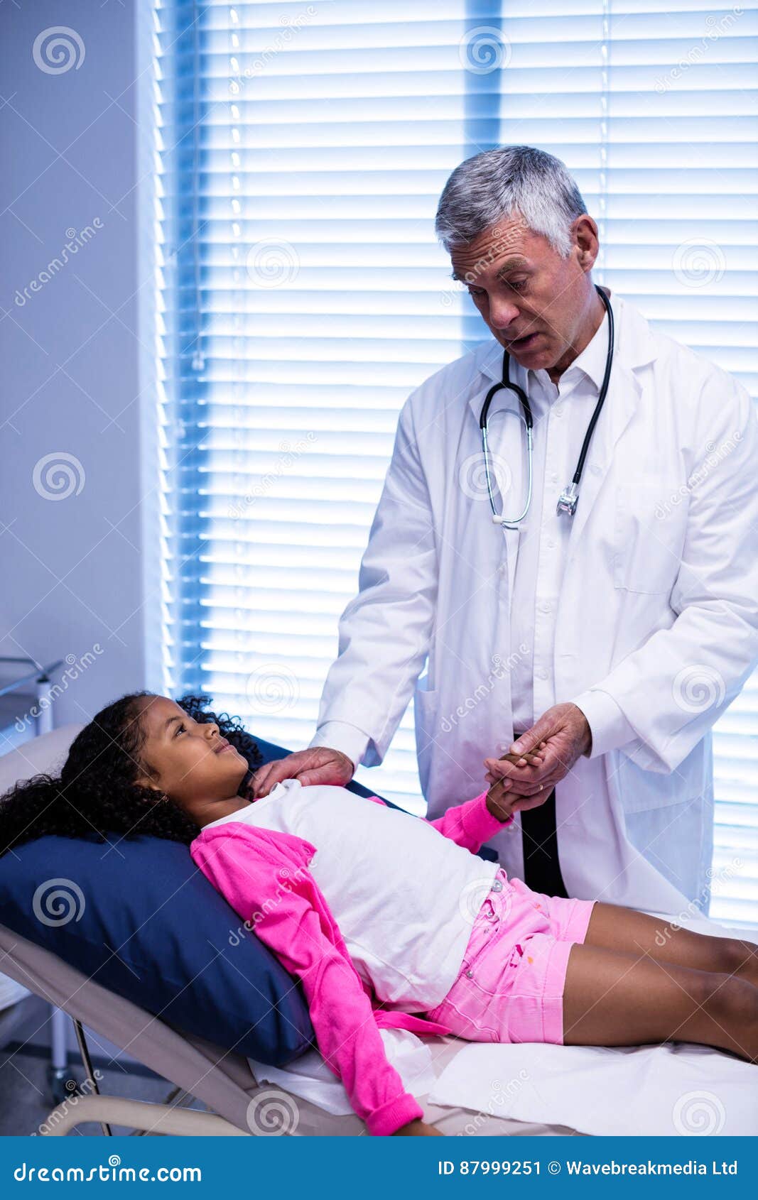 Doctor comforting patient stock image. Image of clothing - 87999251