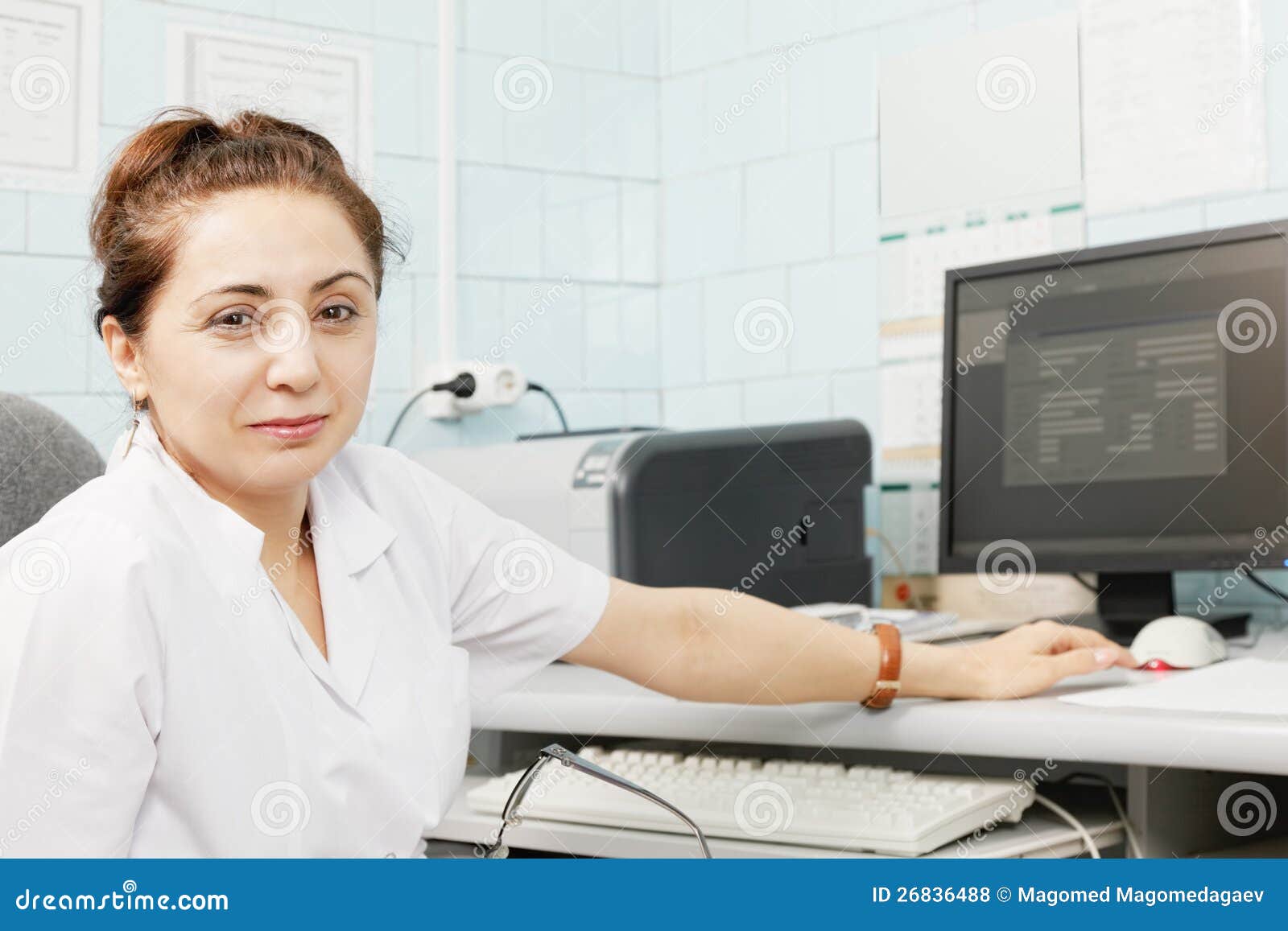 Doctor at computer desk stock photo. Image of positive - 26836488