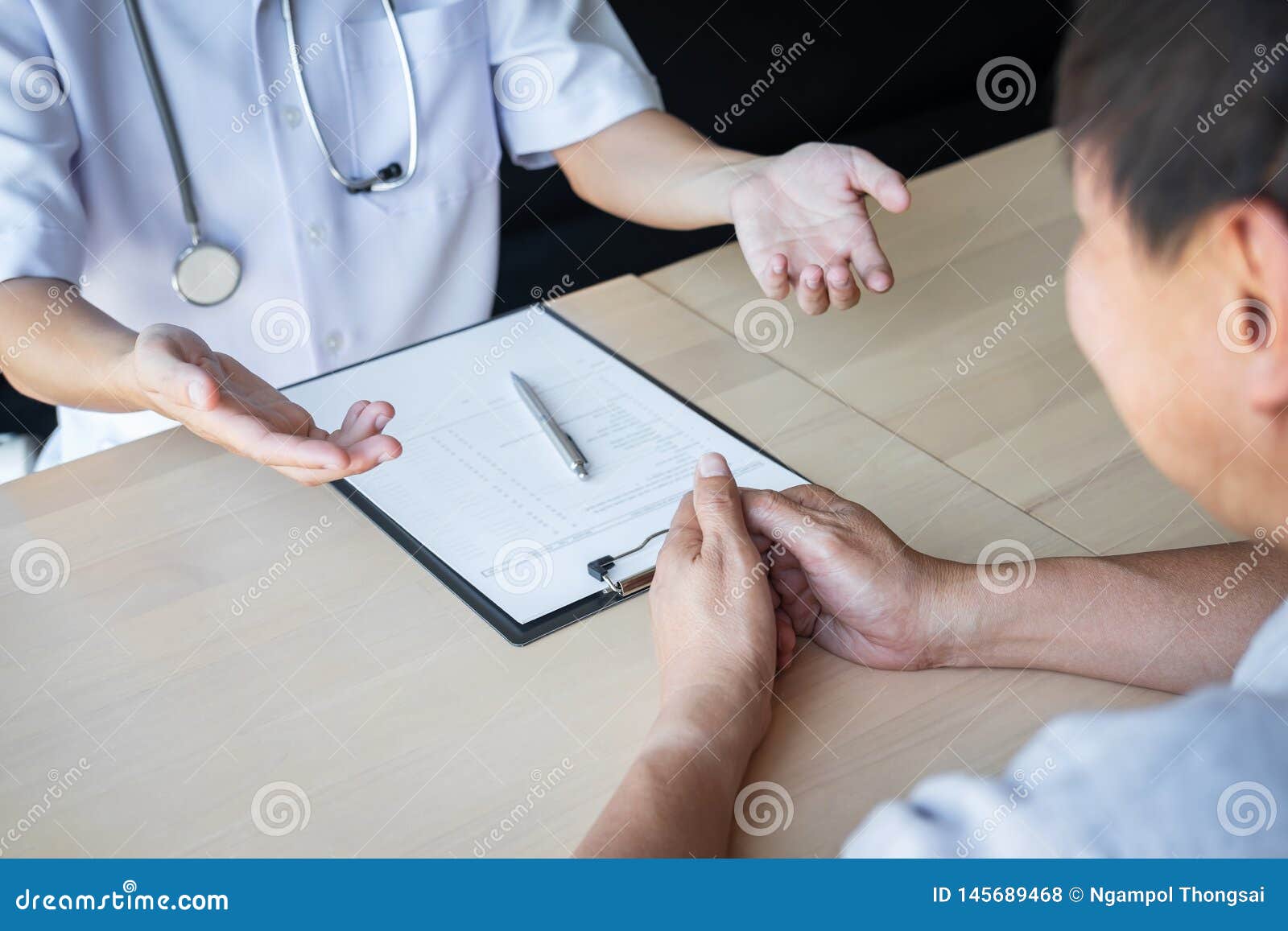 Doctor Consulting with Patient Examining for Patient, Presenting ...
