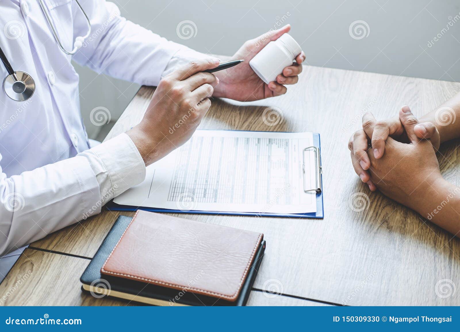 Doctor Consulting with Patient Examining for Patient, Presenting ...
