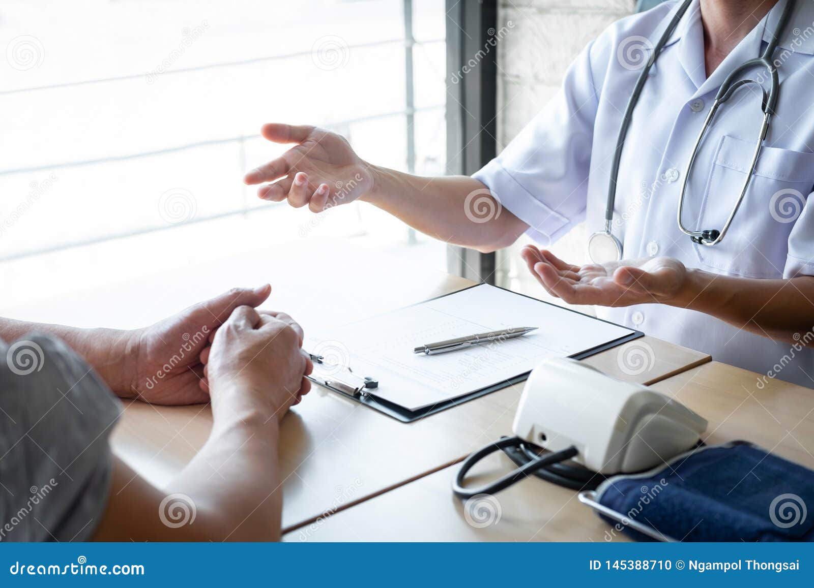 Doctor Consulting with Patient Examining for Patient, Presenting ...