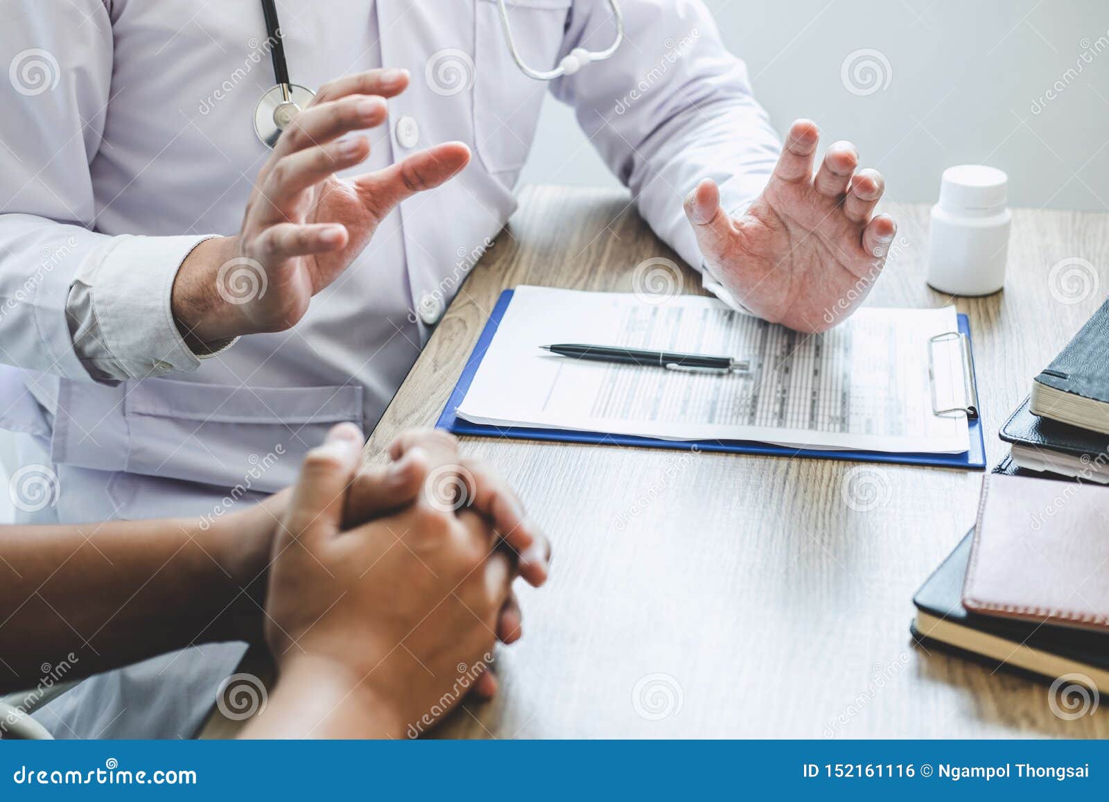 Doctor Consulting with Patient Examining for Patient, Presenting ...