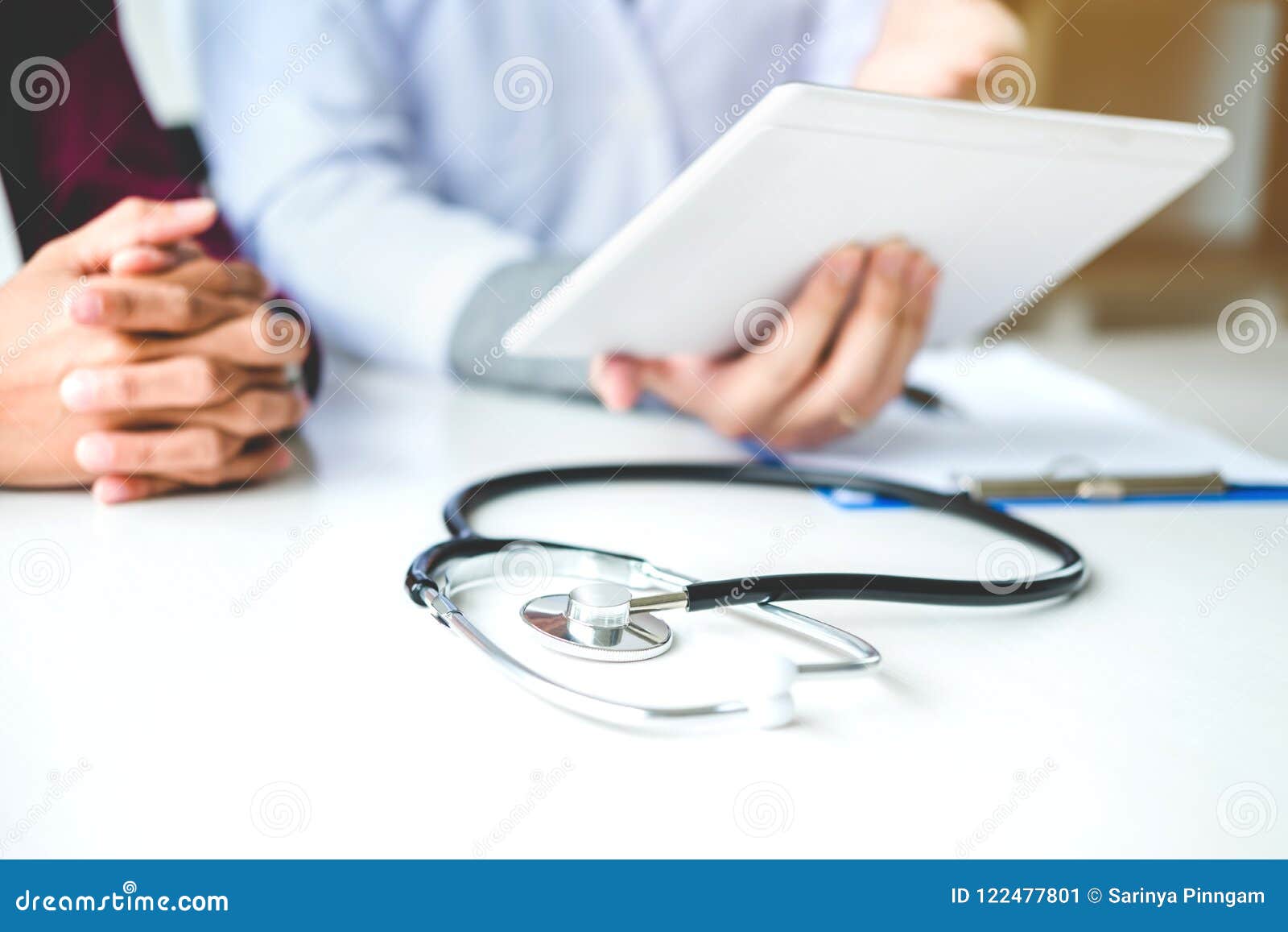 Doctor Consulting with Patient Presenting Results on Digital Tab Stock ...