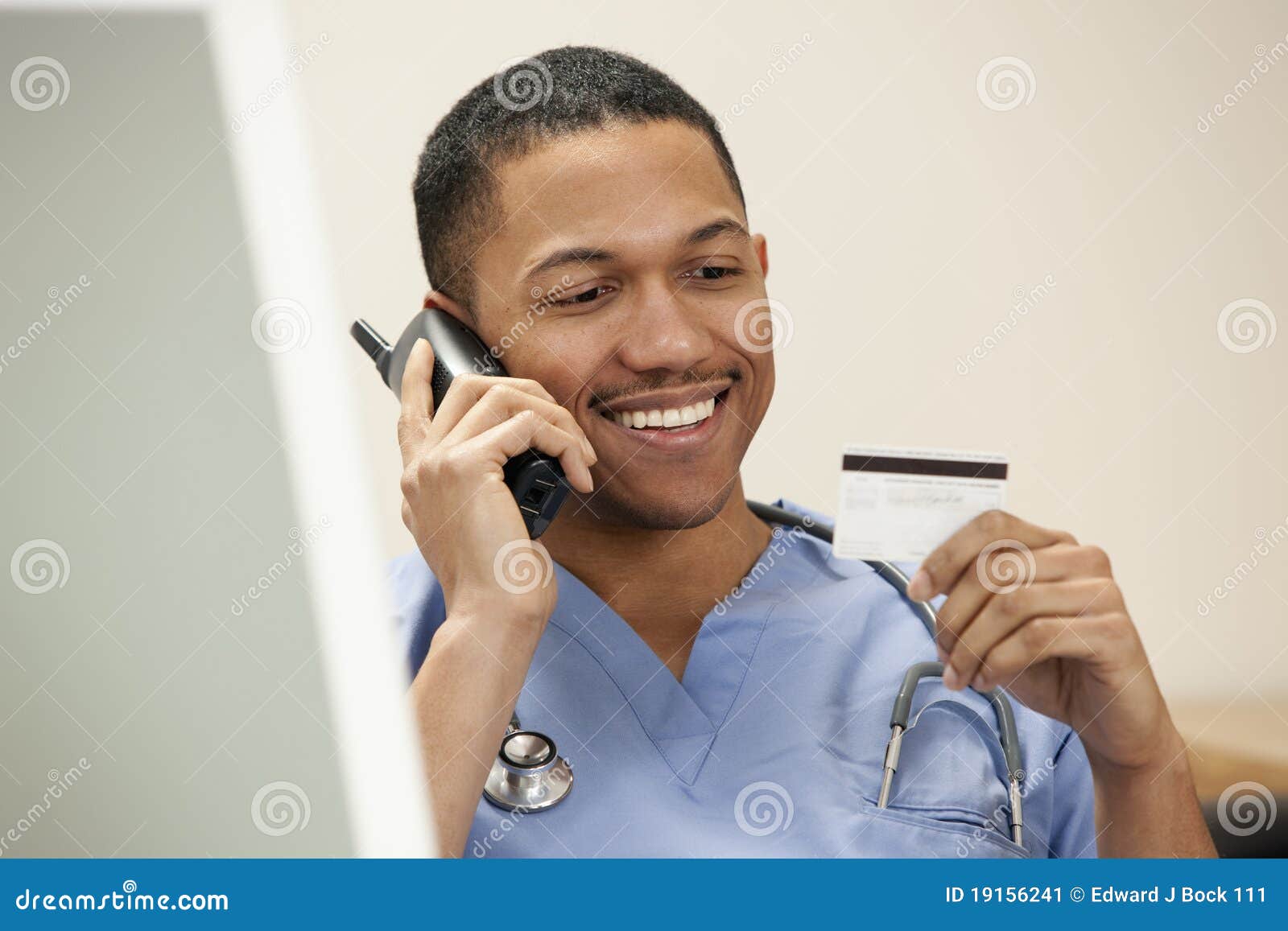 Doctor with Credit Card on Phone Stock Image - Image of male, happy ...
