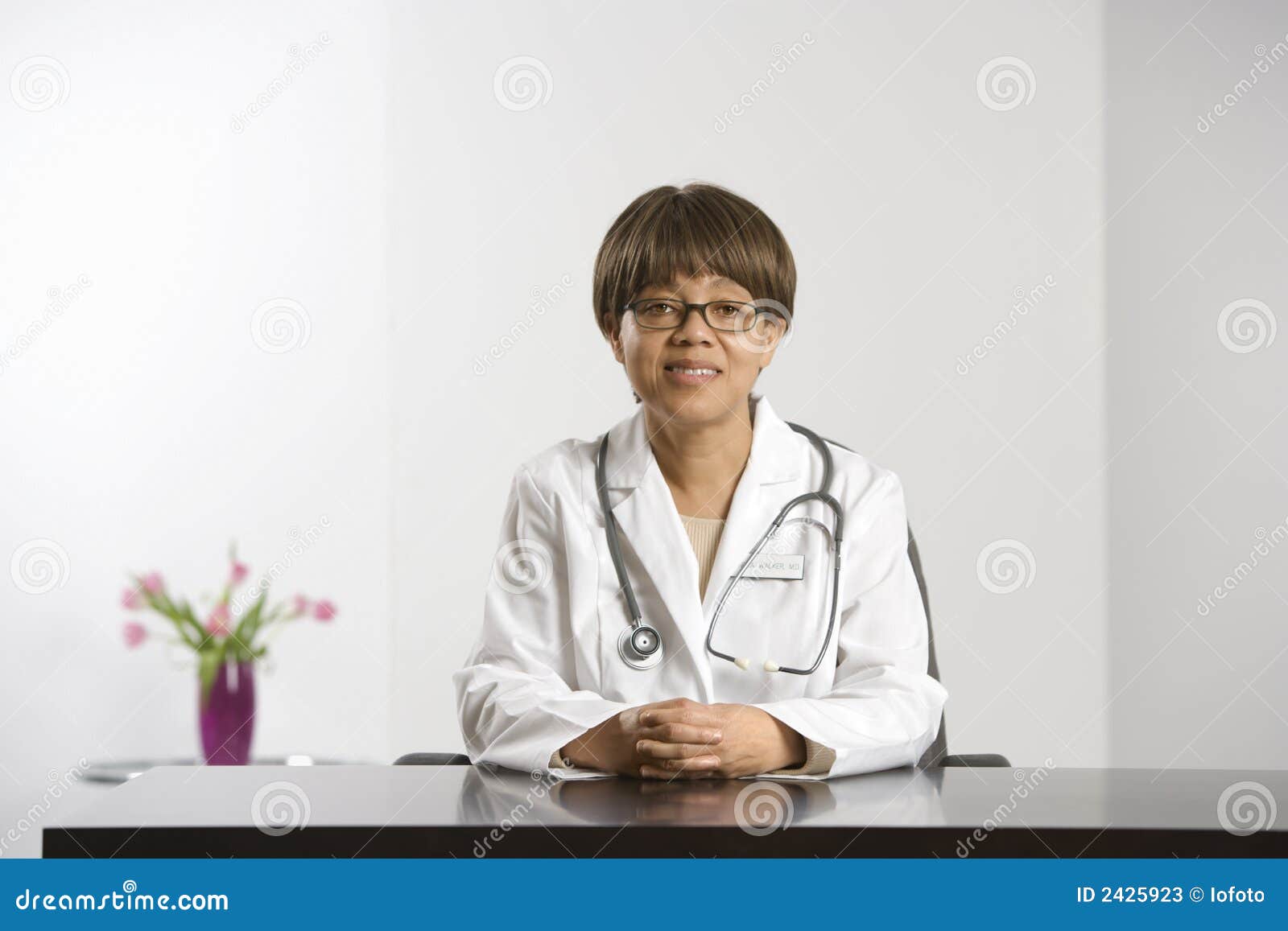 Doctor at desk. stock image. Image of practitioner, photograph - 2425923
