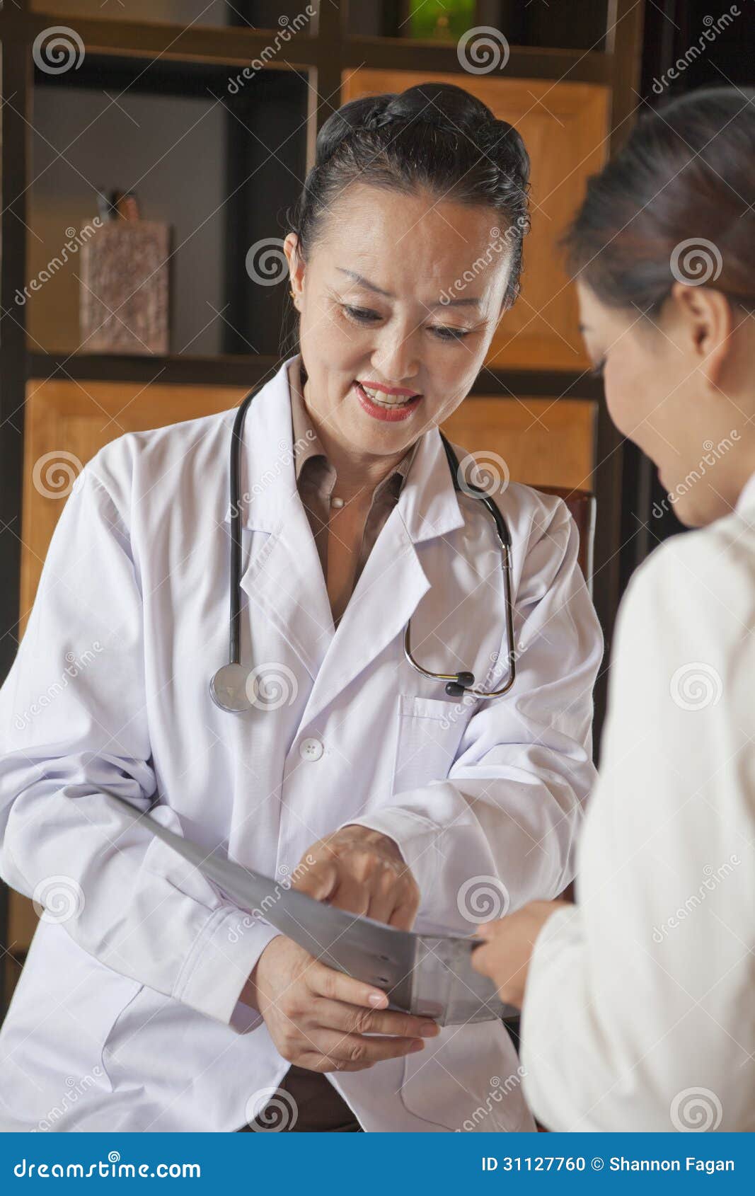Doctor Discussing Medical Chart with Nurse Stock Photo - Image of 5559 ...