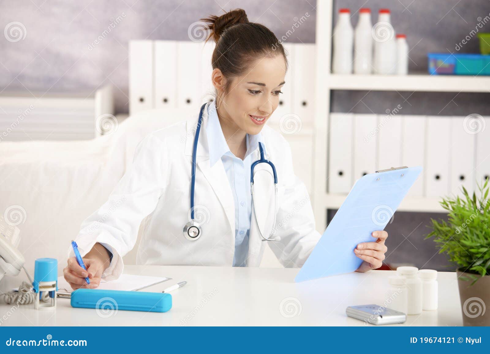 Doctor Doing Paperwork at Office Stock Image - Image of clinic, desk ...