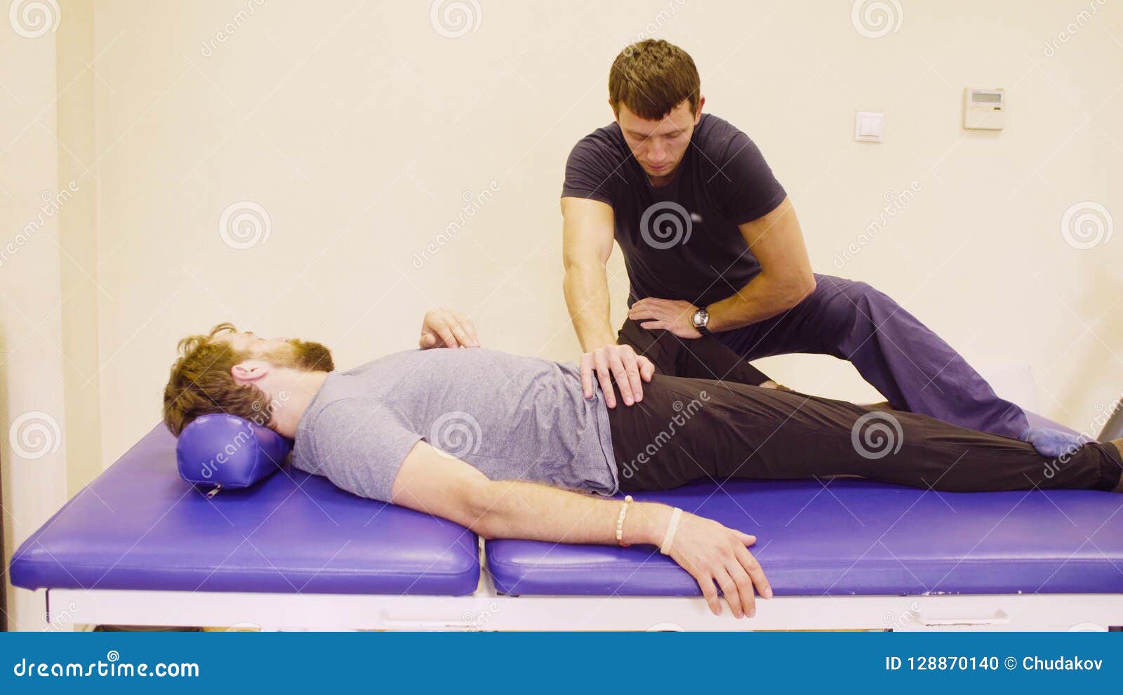 Doctor Doing Stretching Exercises for Disable Man Stock Photo - Image ...