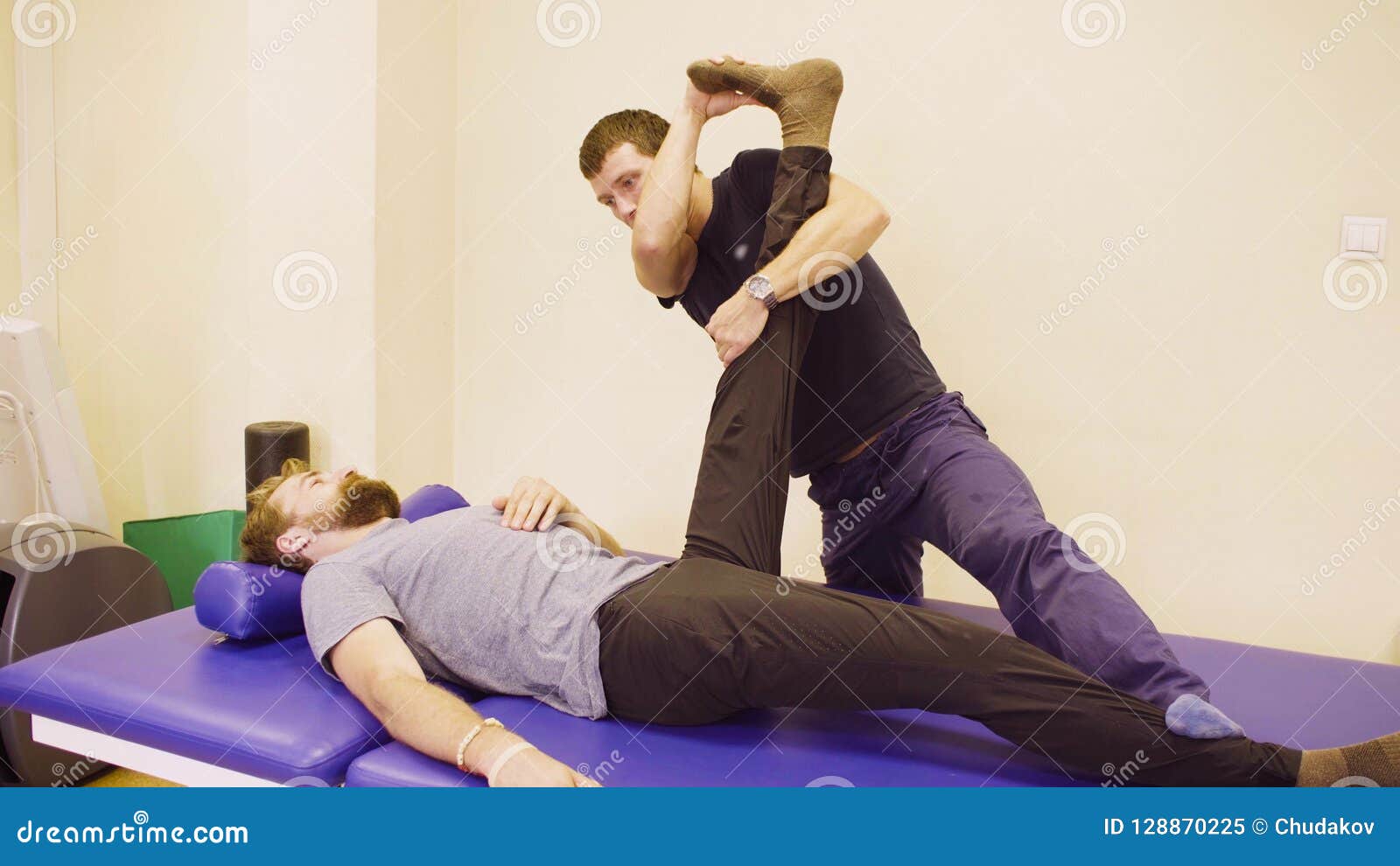 Doctor Doing Stretching Exercises for Disable Man Stock Image - Image ...
