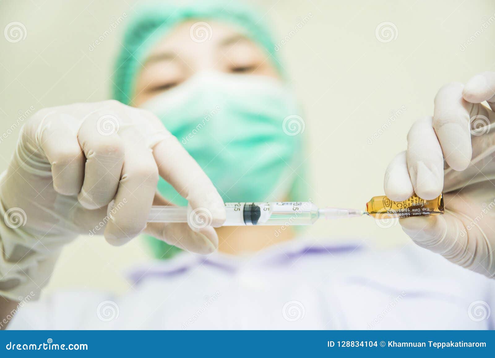 Doctor Drawing a Solution from Bottle for Injection Stock Photo - Image ...