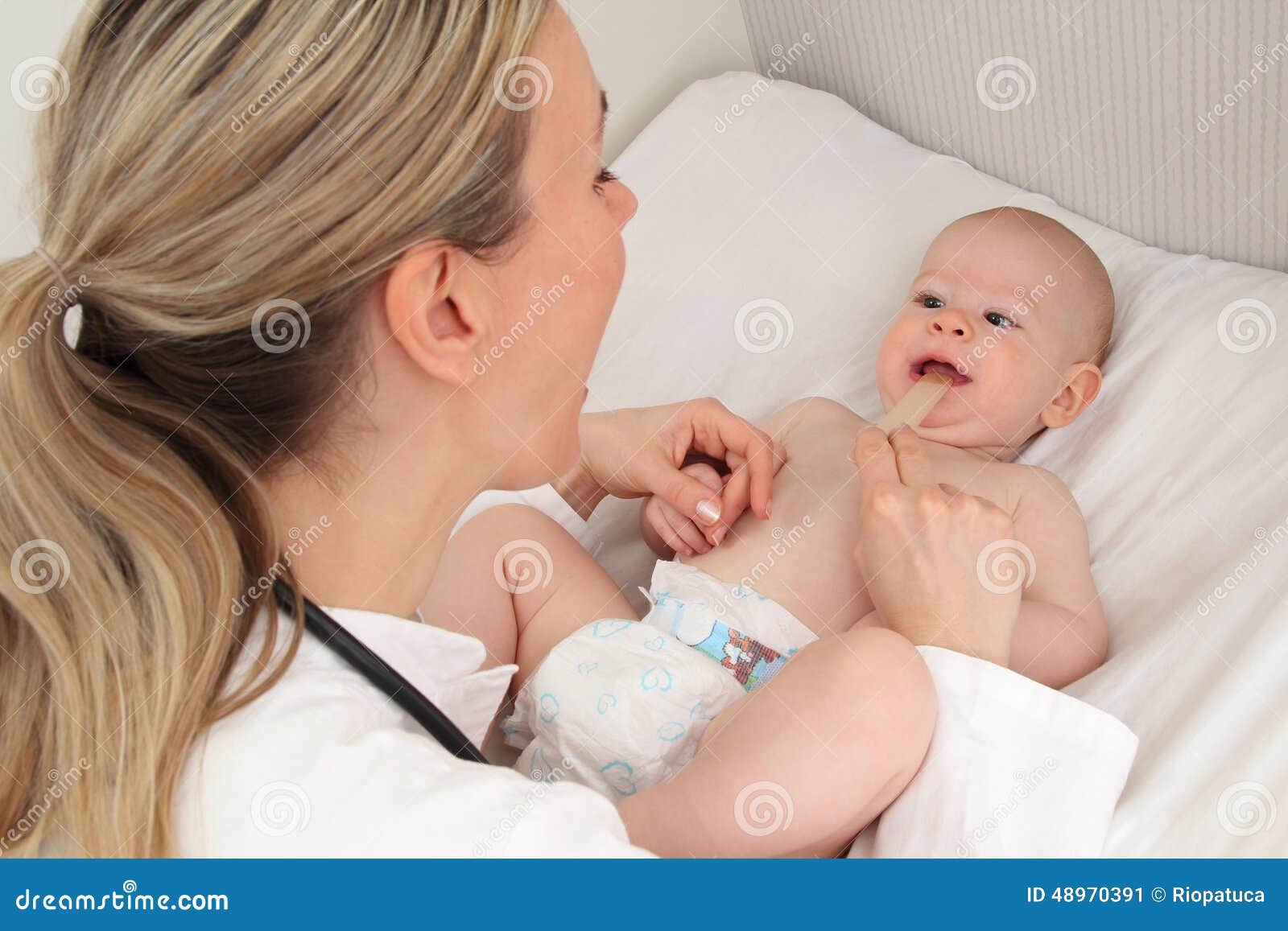 Doctor Examinate a Baby with a Spatula Stock Image - Image of midwife ...