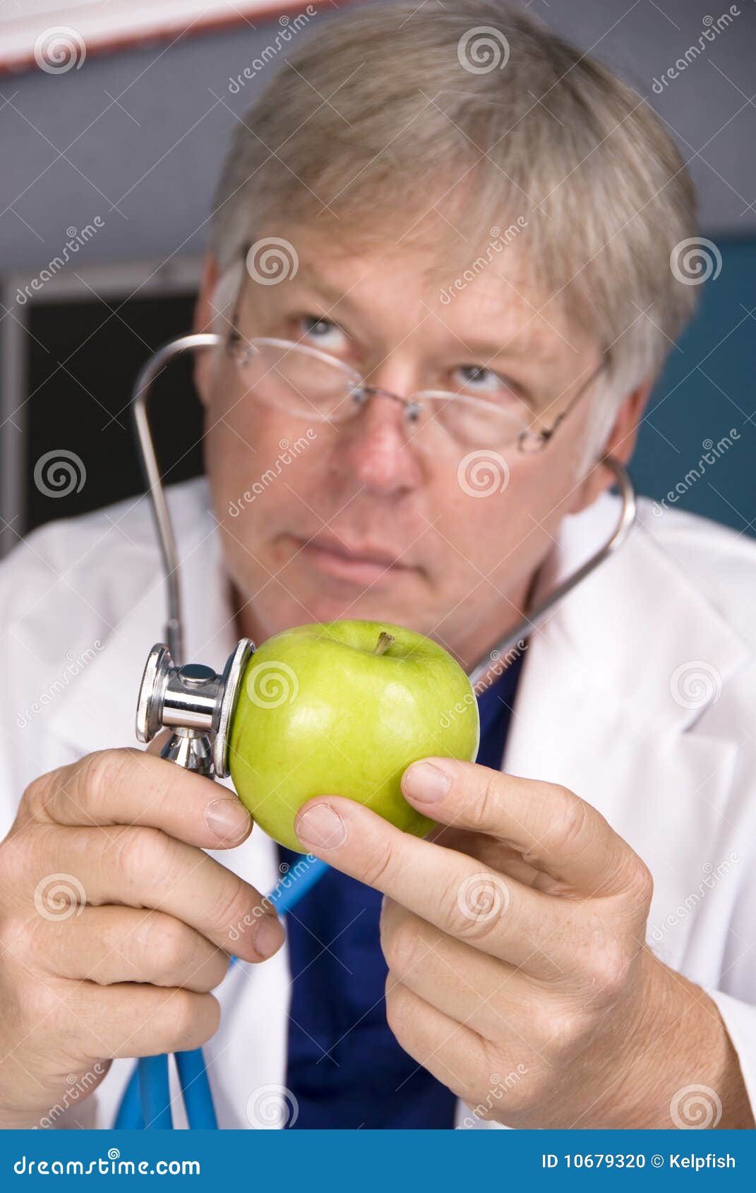 Doctor examines an apple stock photo. Image of healthcare - 10679320