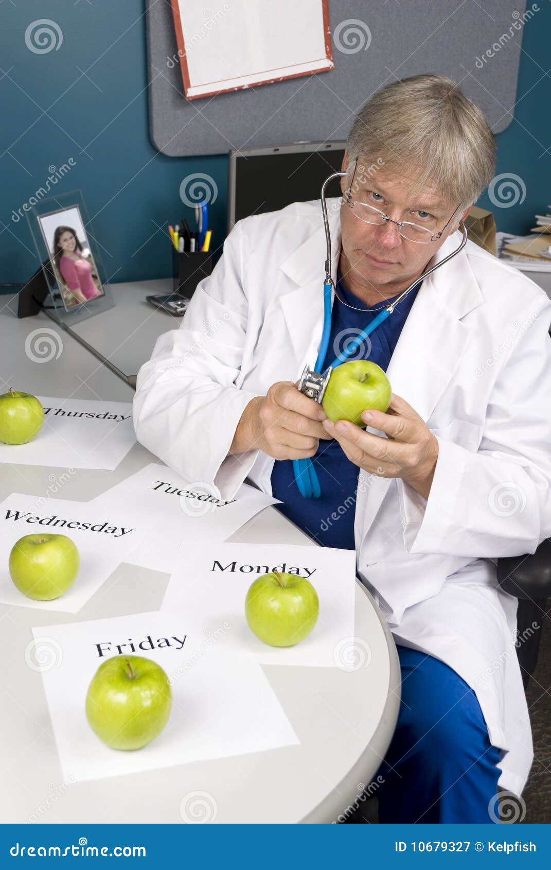 Doctor examines an apple stock image. Image of diet, healthcare - 10679327