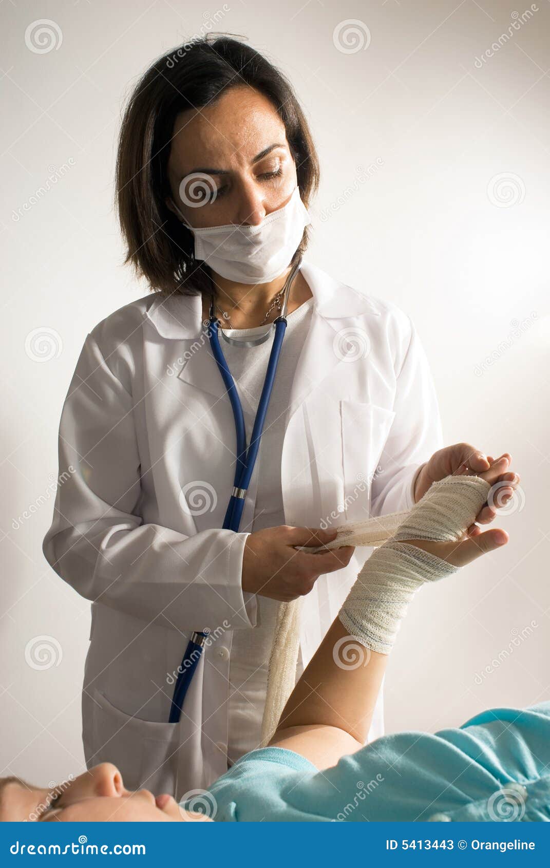 Doctor Examines a Bandaged Arm Stock Image - Image of indoor, child ...