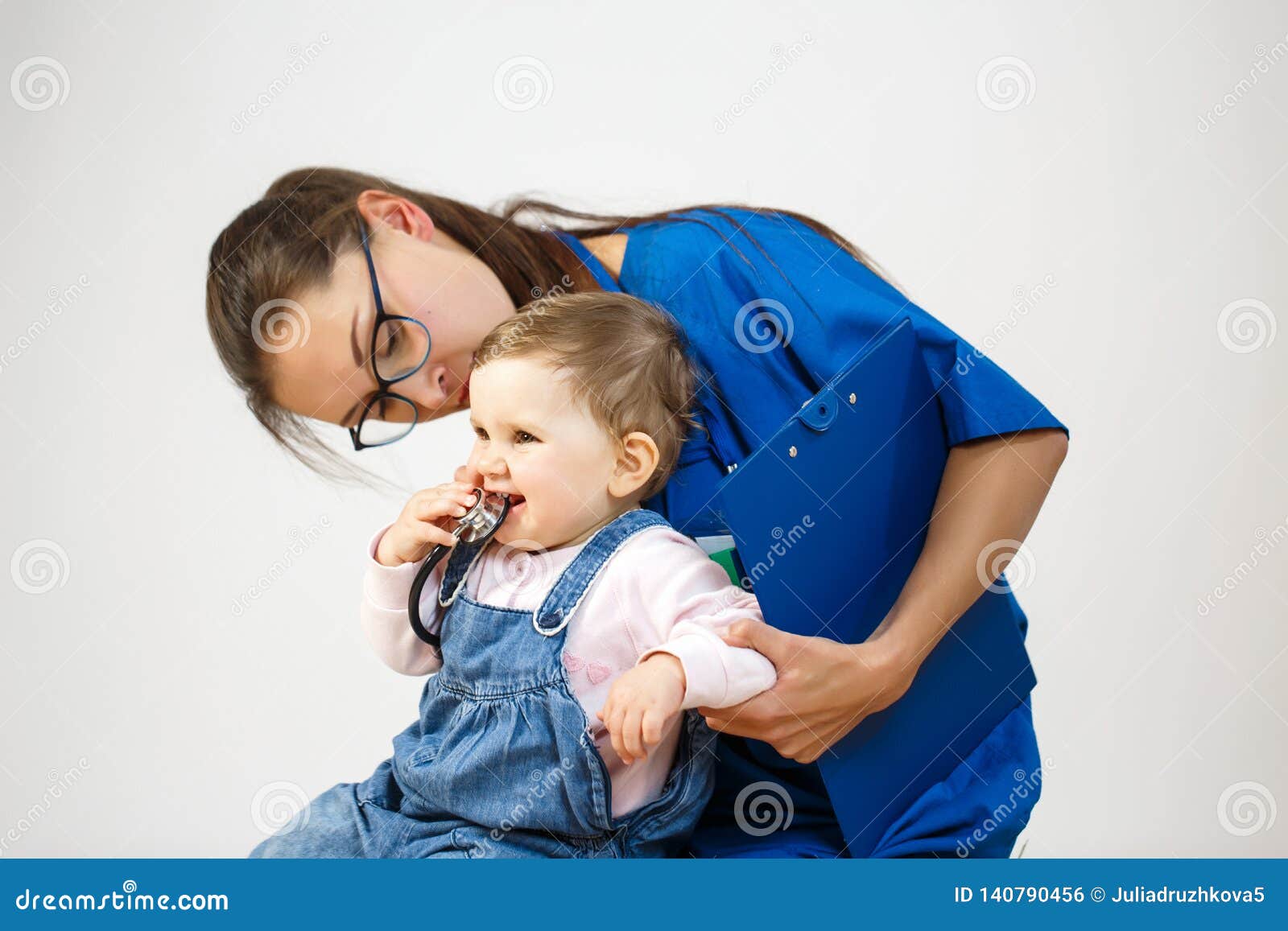 Doctor Examines the Child while he Plays with a Stethoscope Stock Photo ...