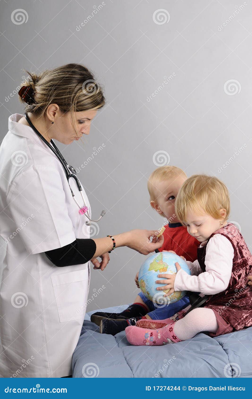 Doctor examining babies stock photo. Image of instrument - 17274244
